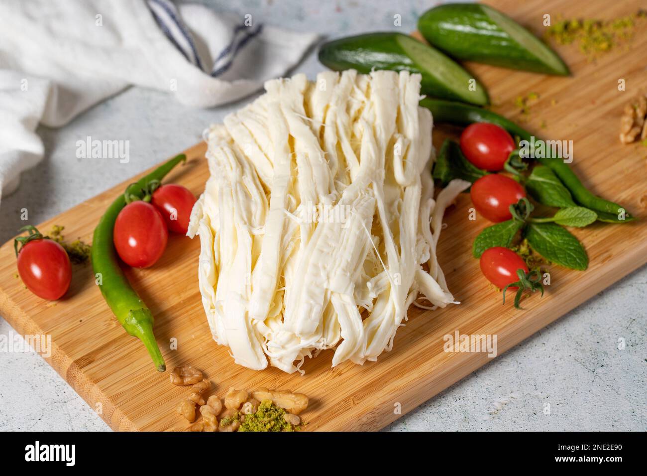 String cheese or Cecil cheese on a wood serving board. Dairy products ...