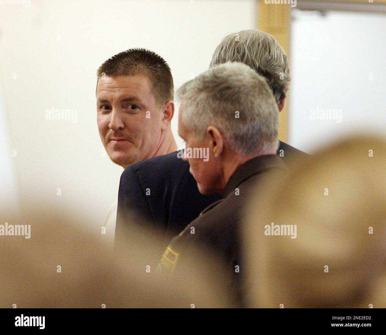 Jesse Brooks, 33, looks back at family and friends after being ...