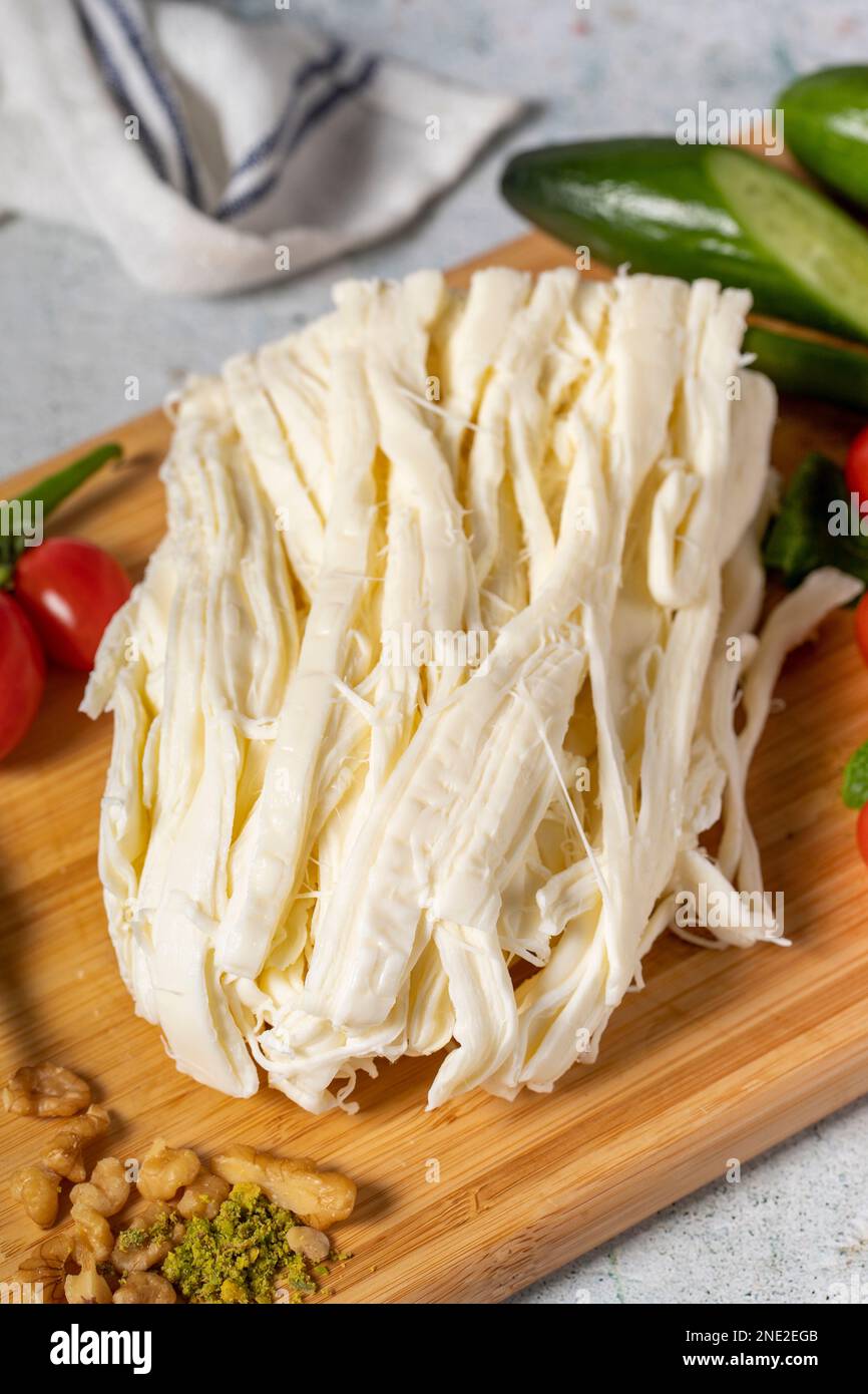 String cheese or Cecil cheese on a wood serving board. Dairy products ...