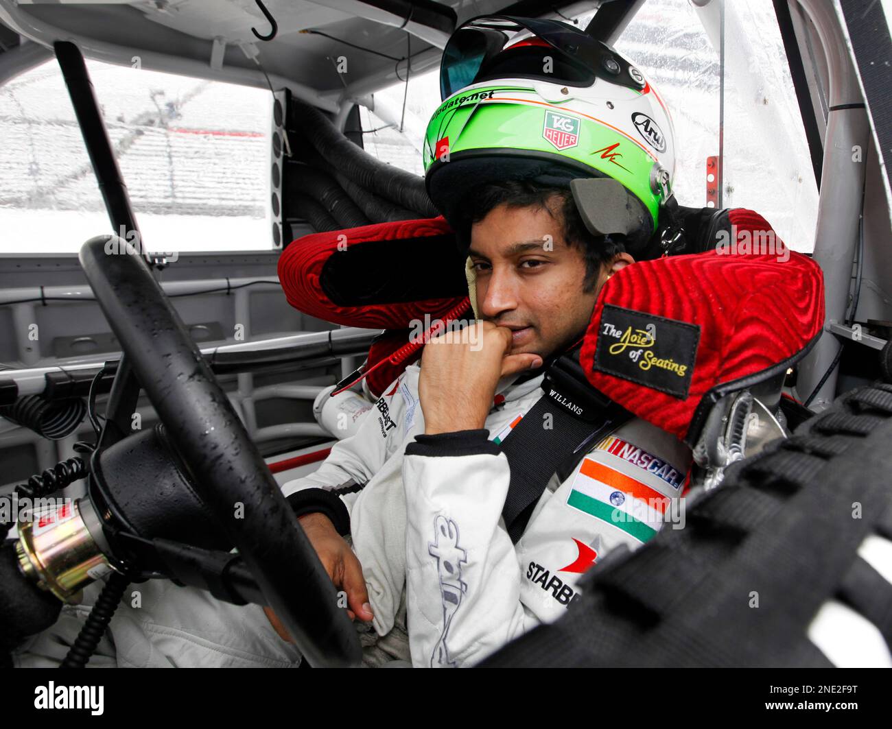 Formula One race car driver, Narain Karthikeyan, from India, waits out ...