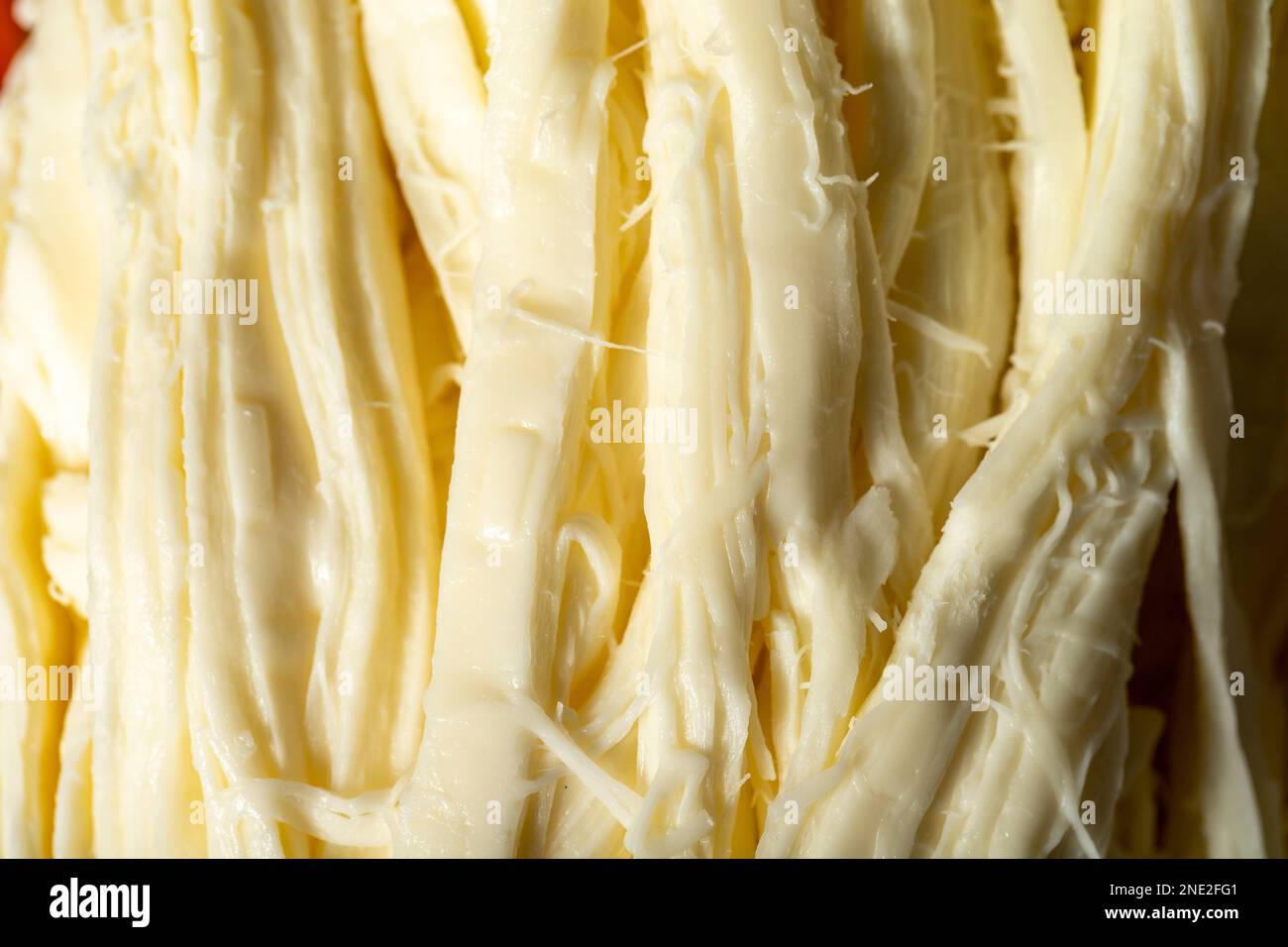 String cheese or Cecil cheese on a wood serving board. Dairy products ...