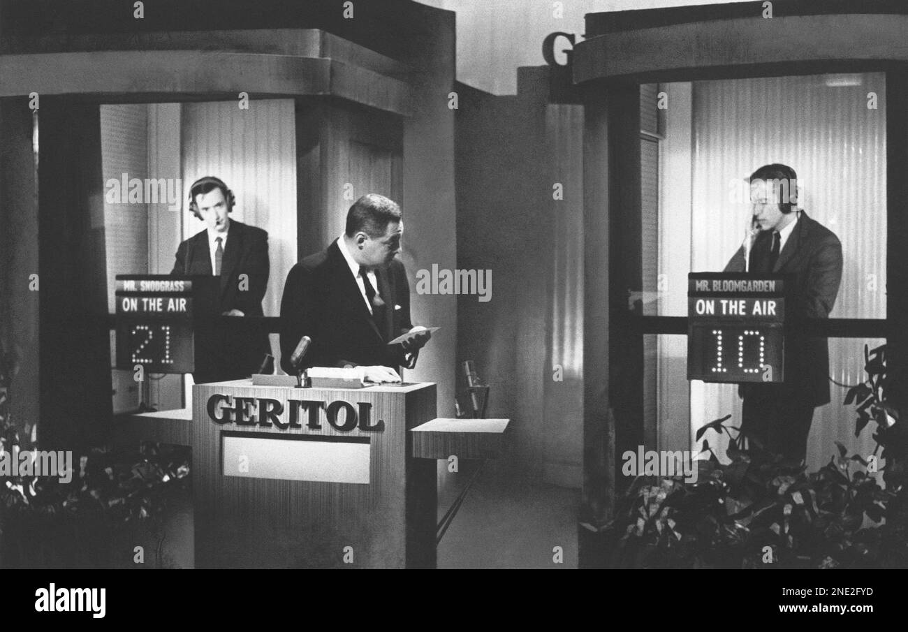 Quizmaster Jack Barry conducts questioning of contestants James ...