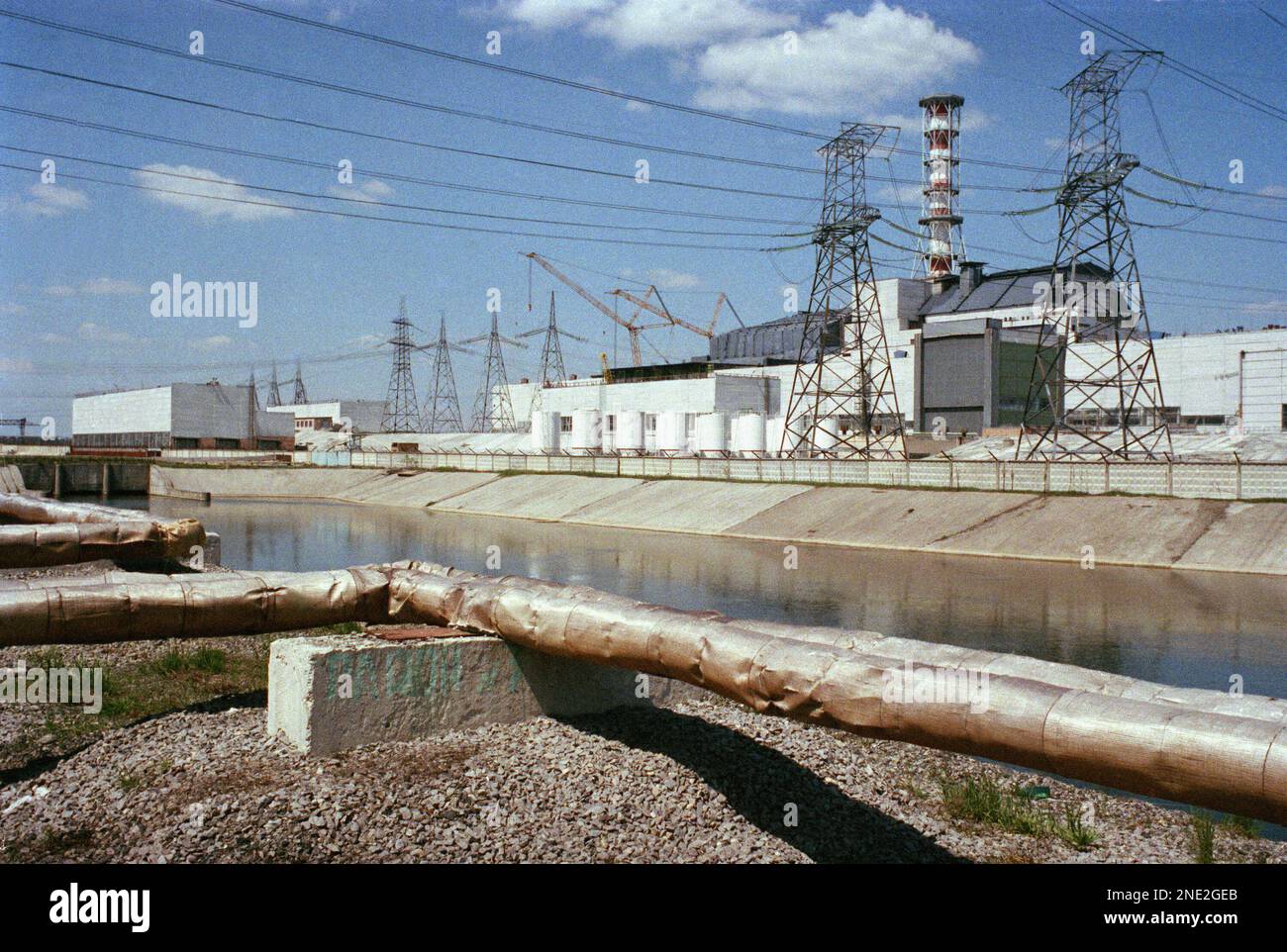 Reactor No. 4 of the Chernobyl nuclear power plant stands encased in ...
