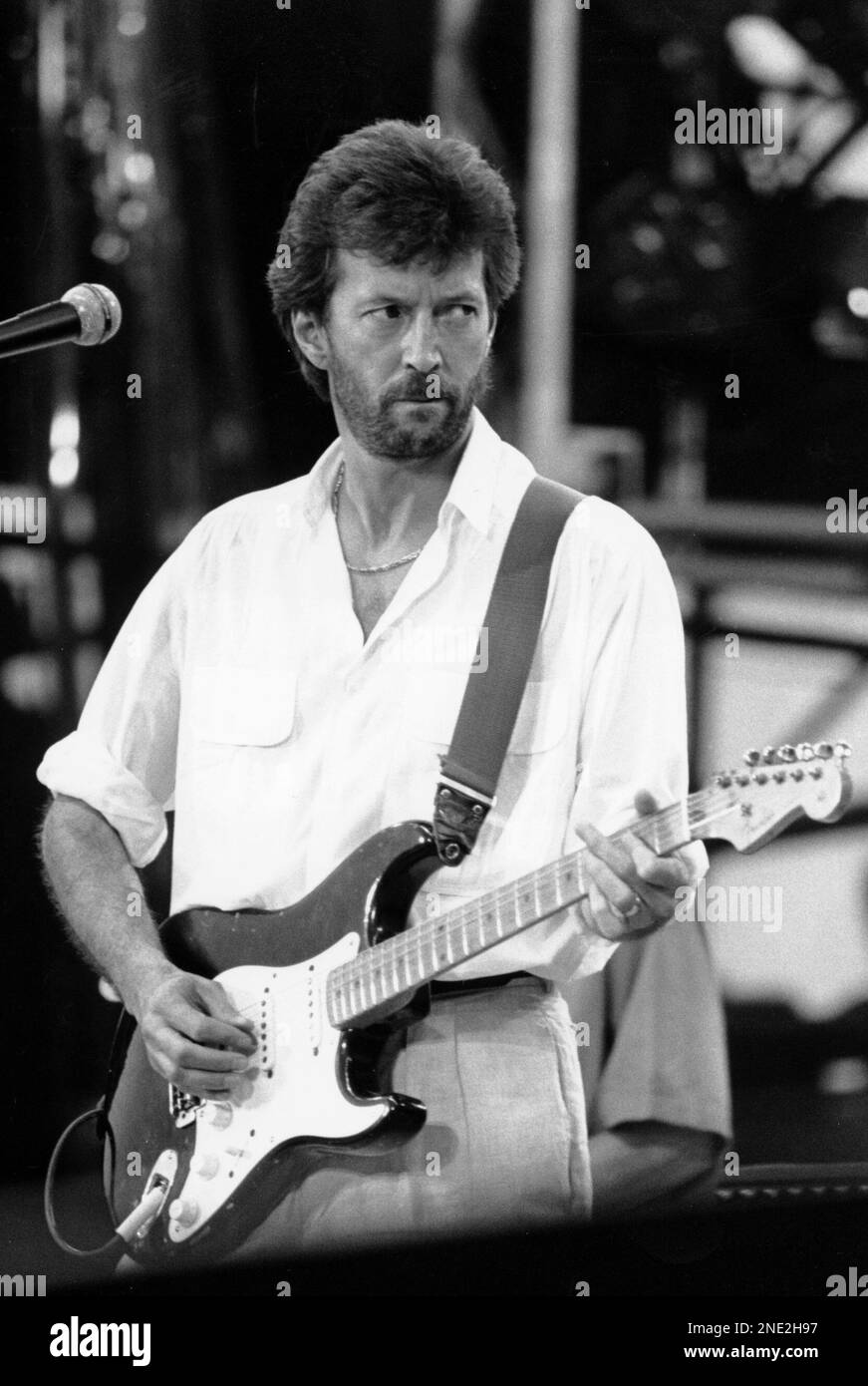 FILE - Eric Clapton is shown performing on stage at the Live Aid ...