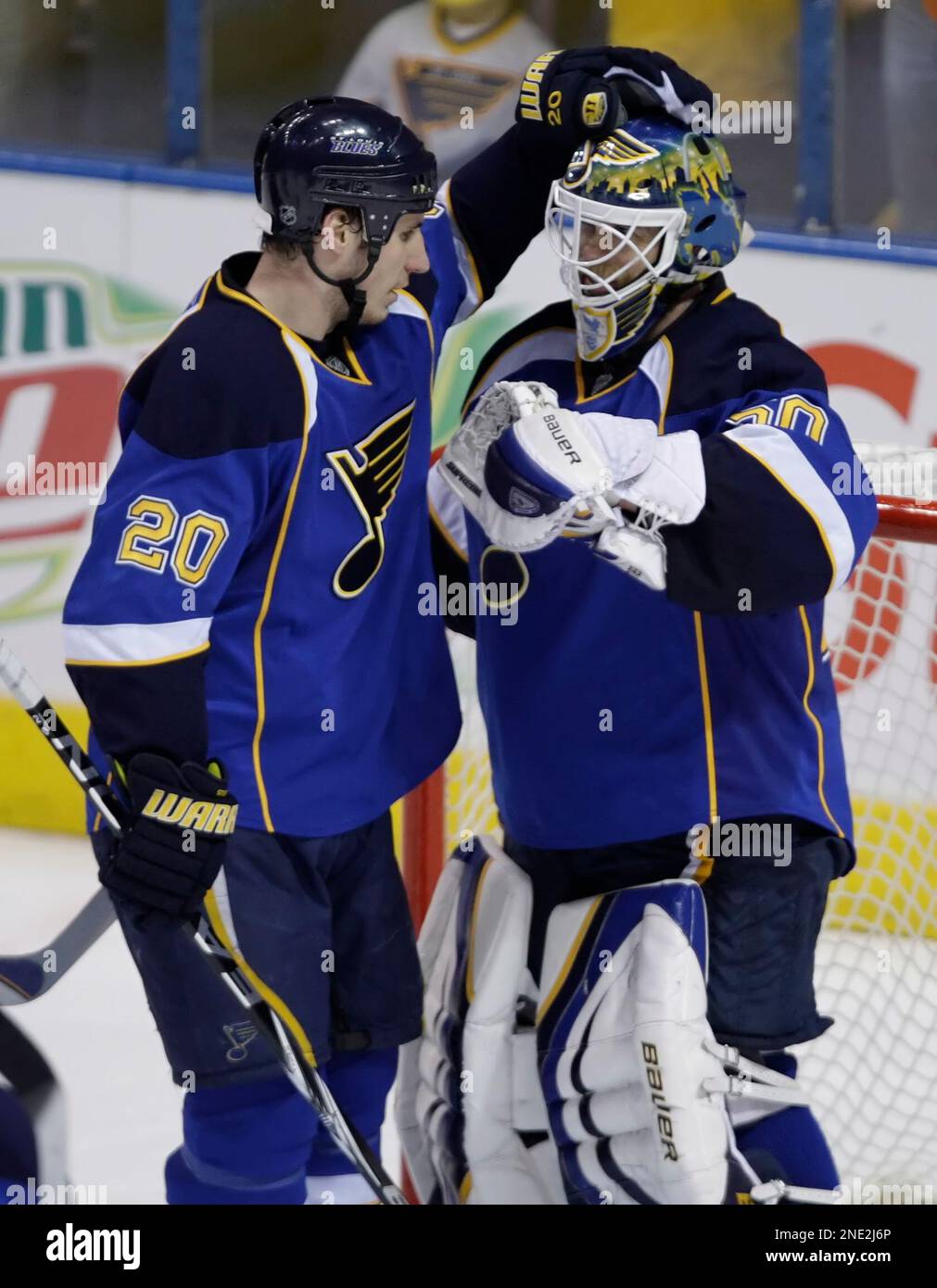 St. Louis Blues goalie Chris Mason (50) is congratulated by teammate ...