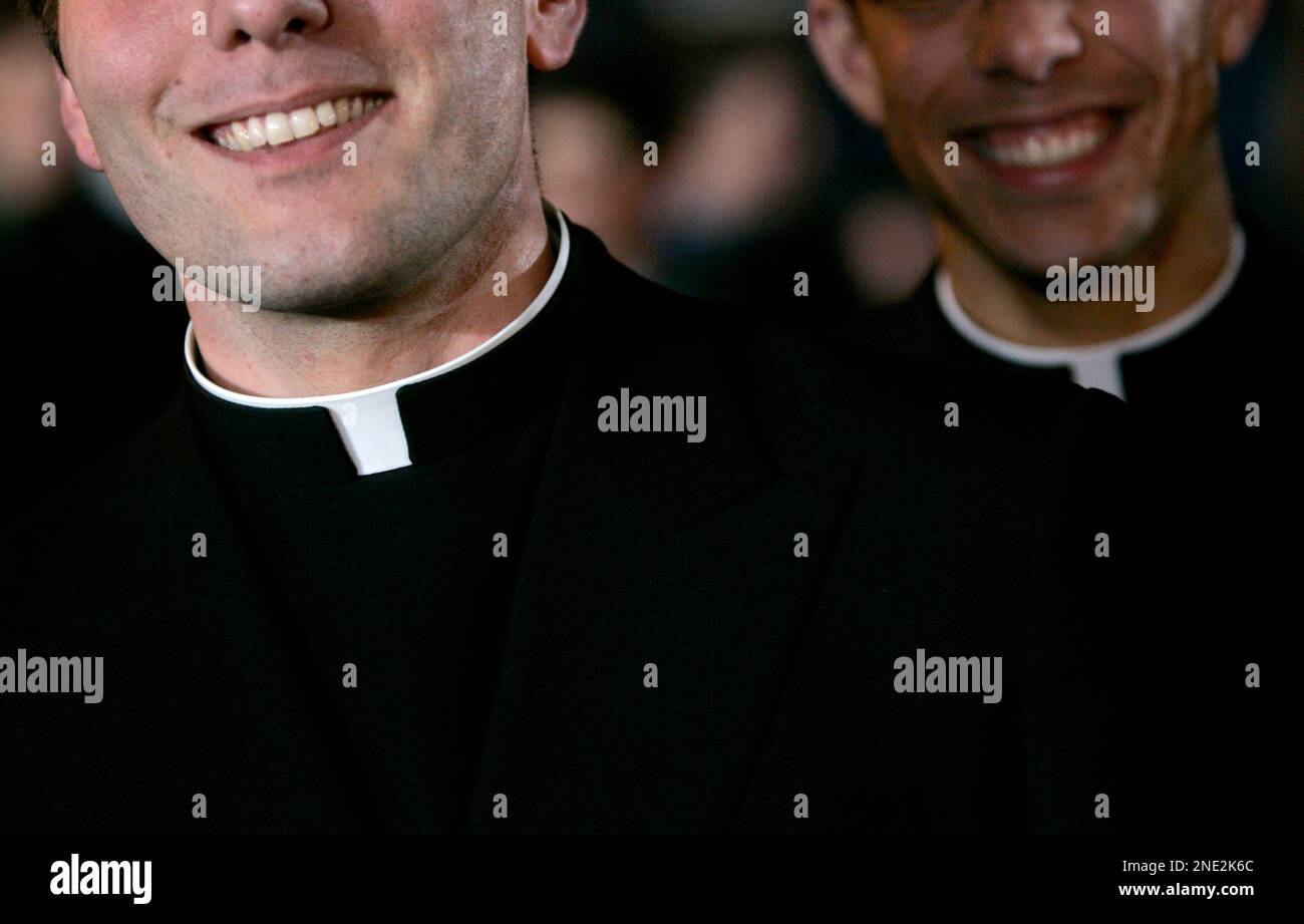 Priests smile as they take part in a youth gathering with Pope Benedict ...