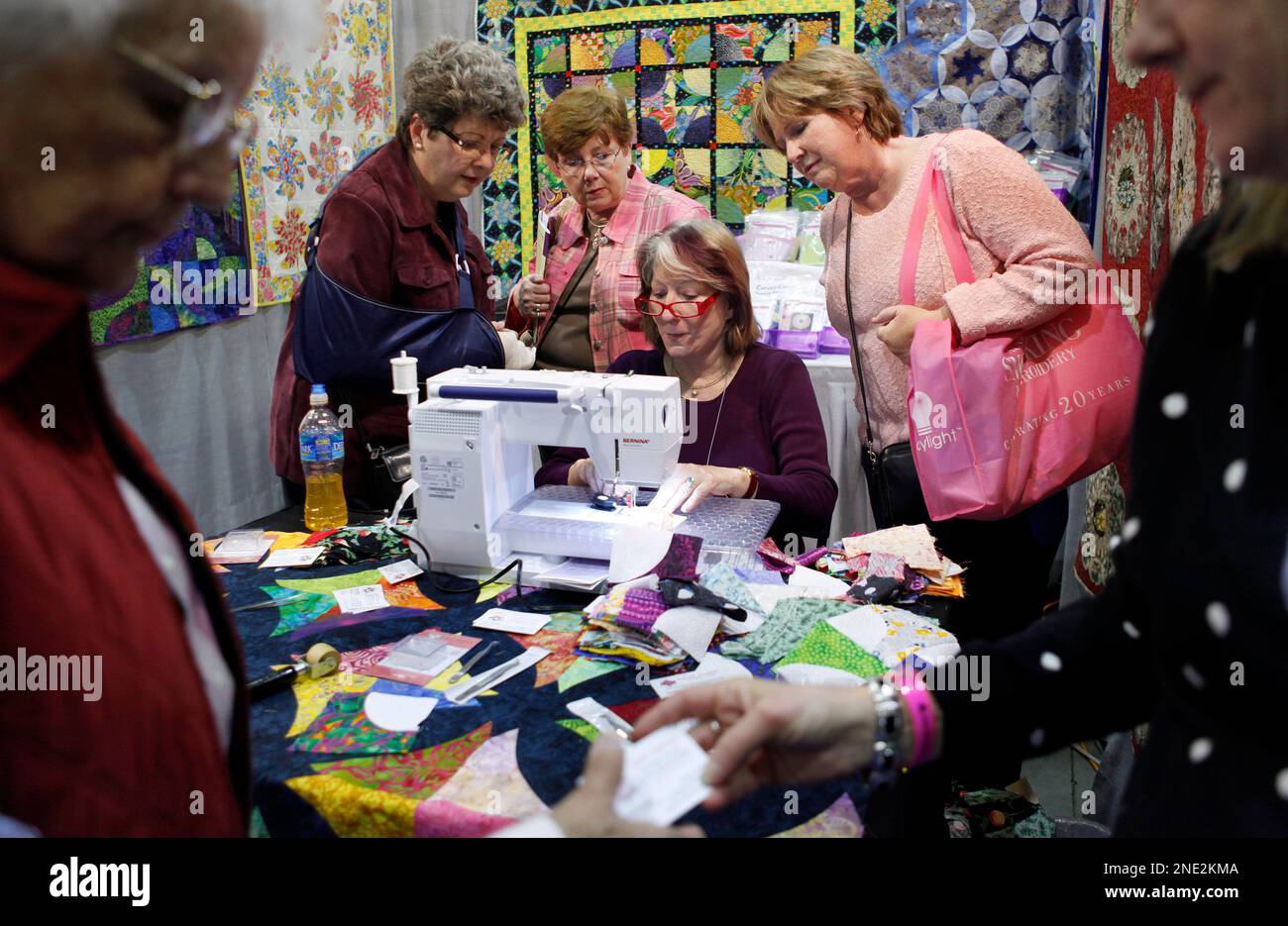 Sandra Chandler, of Hunt, Texas, seated at the sewing machine, creator ...
