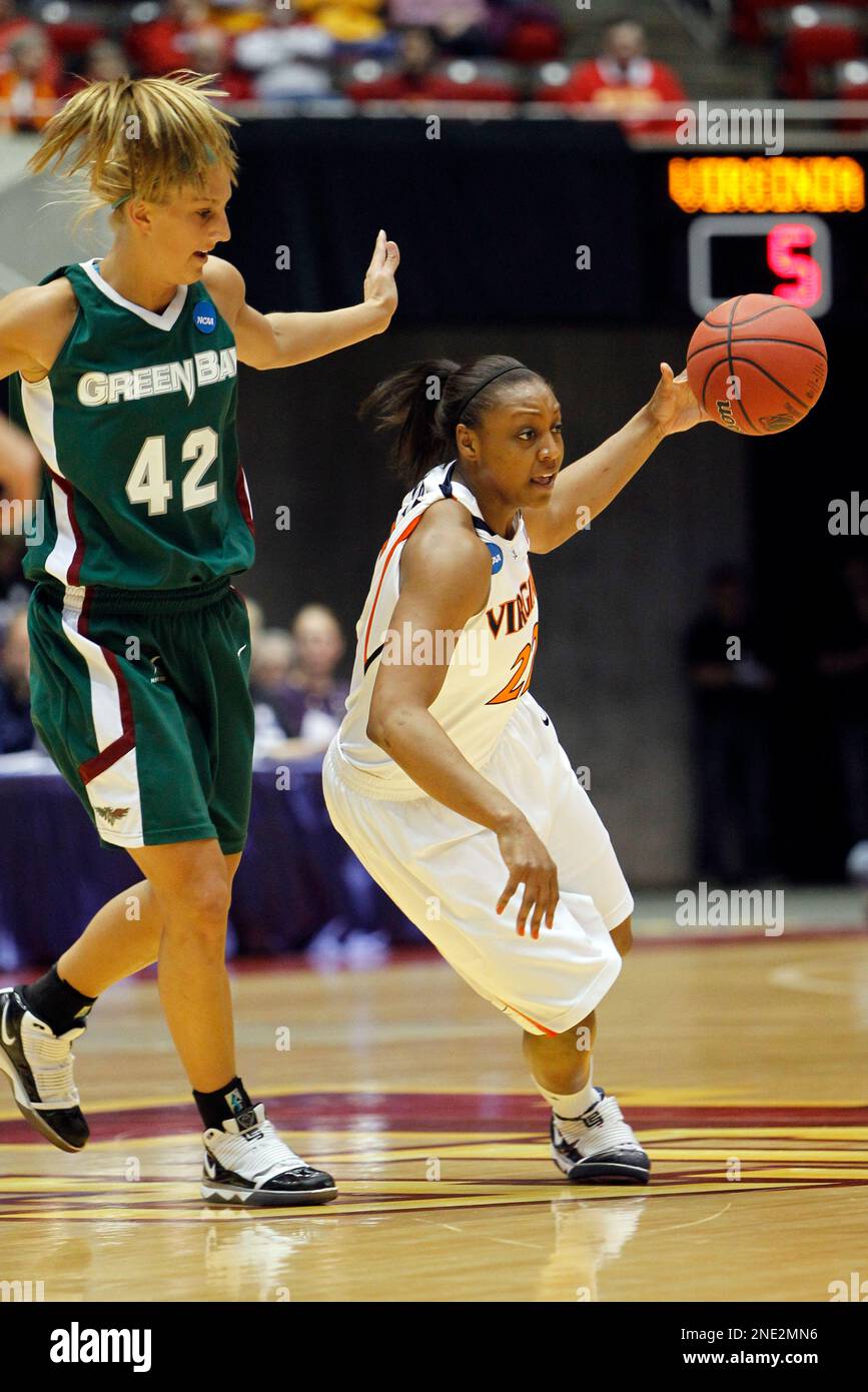 Virginia forward Monica Wright, right, drives past Wisconsin-Green Bay ...