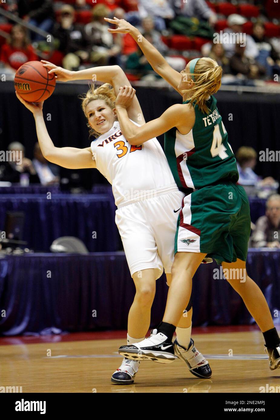 Virginia forward Jayna Hartig, left, looks to pass around Wisconsin ...