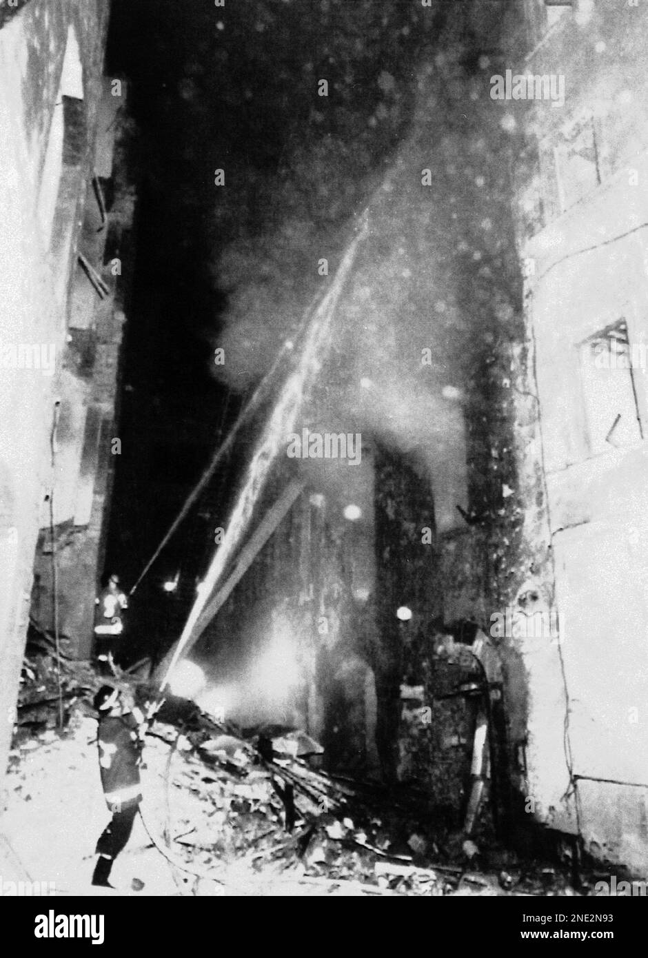 Fireman try to extinguish the fire following a huge explosion which ...