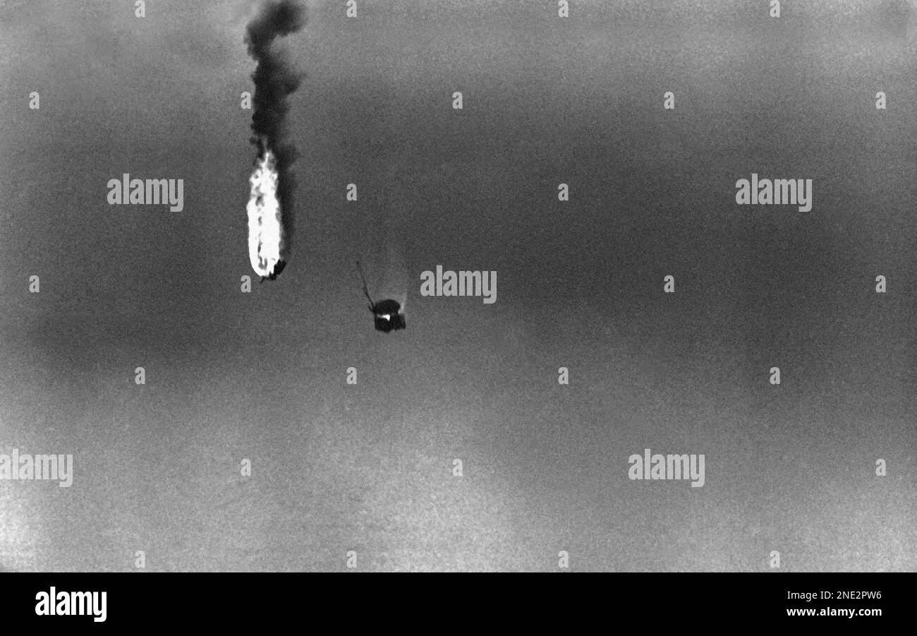 The flaming object at left was described by observers as the nose cone ...