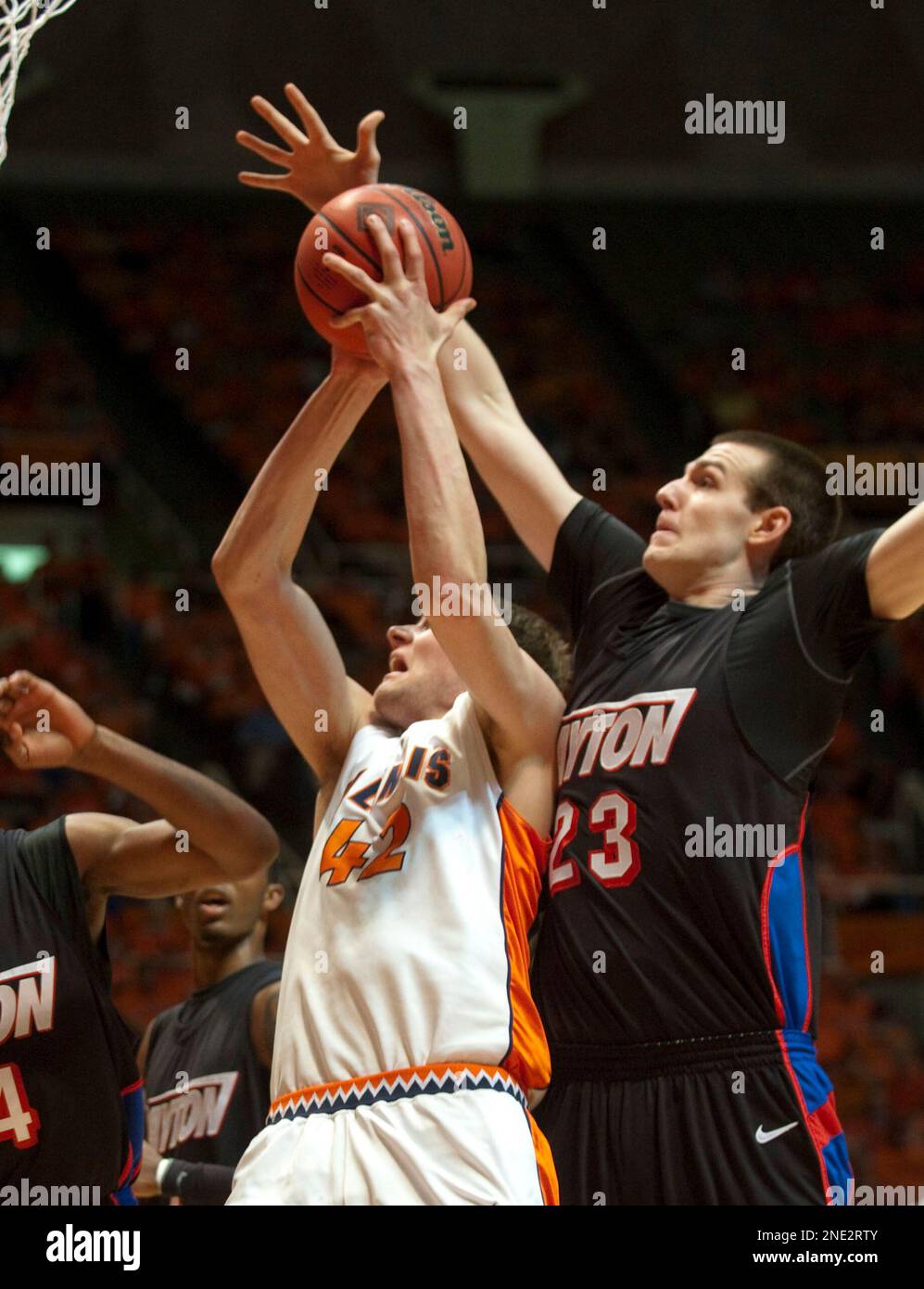 Dayton's Luke Fabrizius (23) defends as Illinois' Tyler Griffey (42 ...