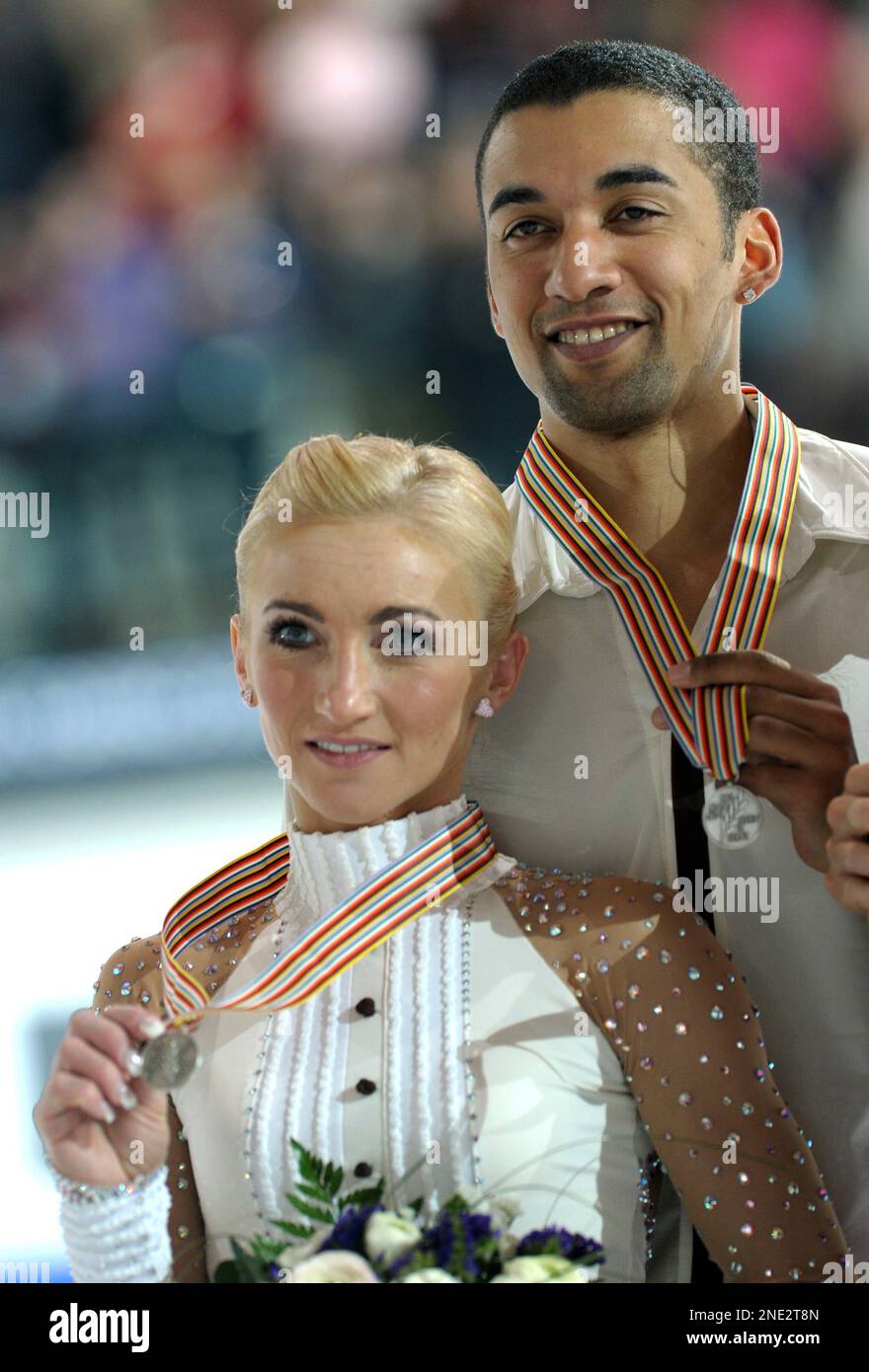 Germany's Aliona Savchenko and Robin Szolkowy show the silver medals they won in the pairs ...