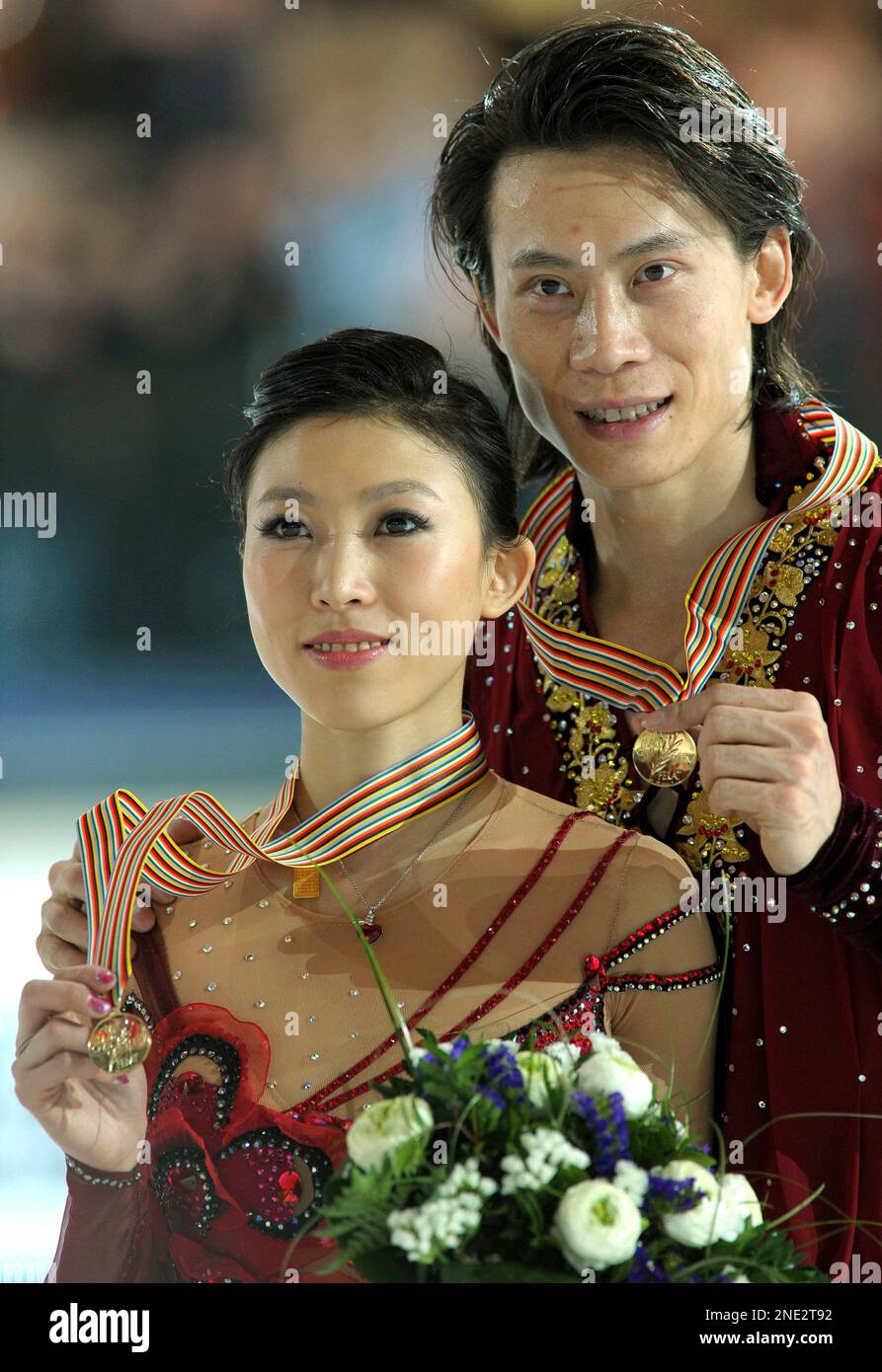 China's Pang Qing and Tong Jian show the gold medals they won in the ...