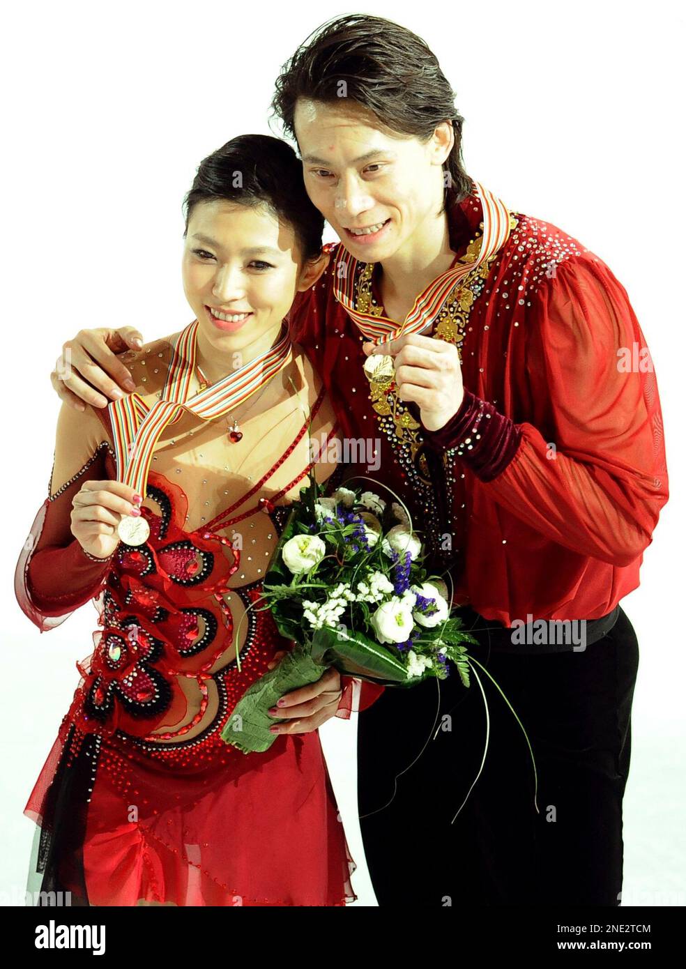 China's Pang Qing and Tong Jian show the gold medal they won in the ...