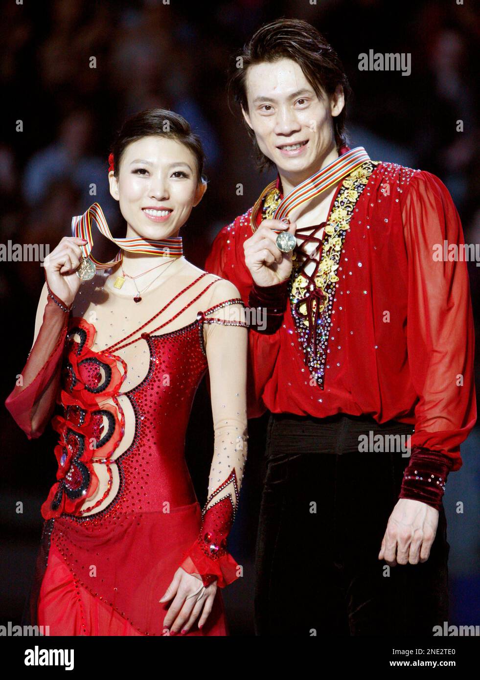 China's Pang Qing and Tong Jian show the gold medal they won in the ...