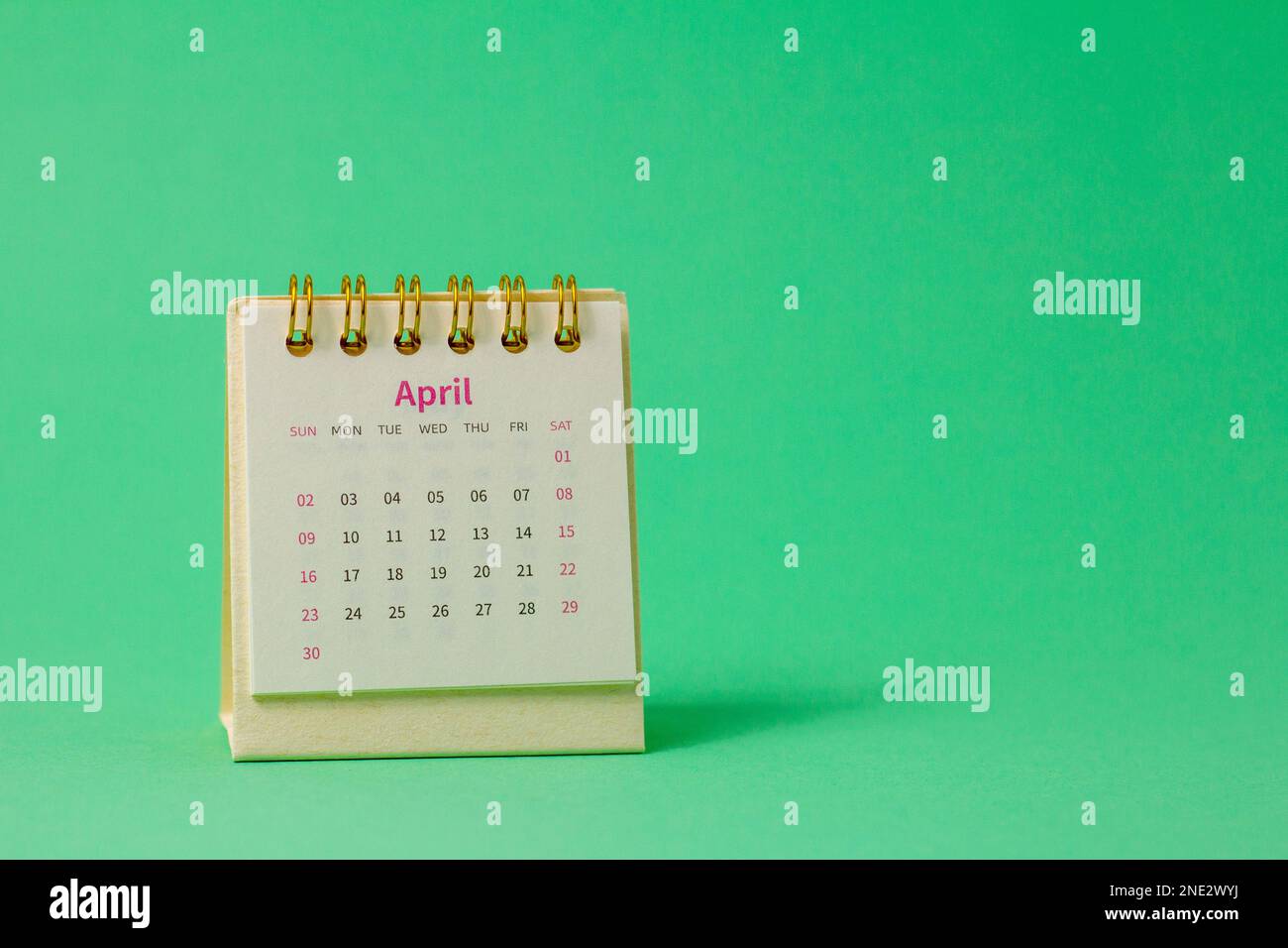 Hello April.Desktop calendar for April 2023 on the table Stock Photo ...