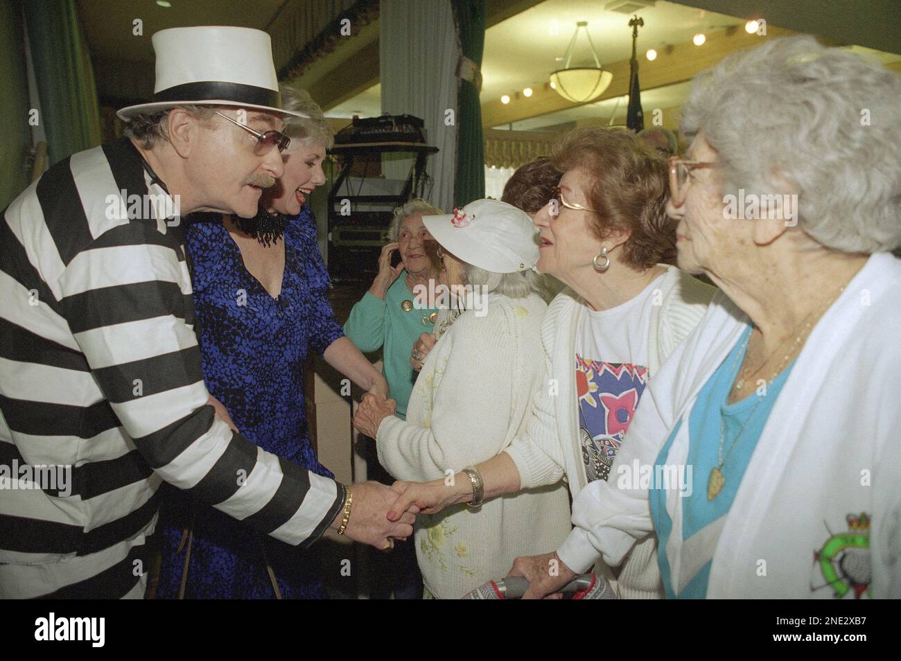 Comedian Marty Ingels, sporting a jailbird outfit and his wife Shirley ...