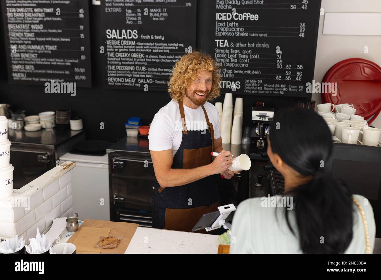 Happy diverse woman and male barista taking order in cafe. Cafe, free ...