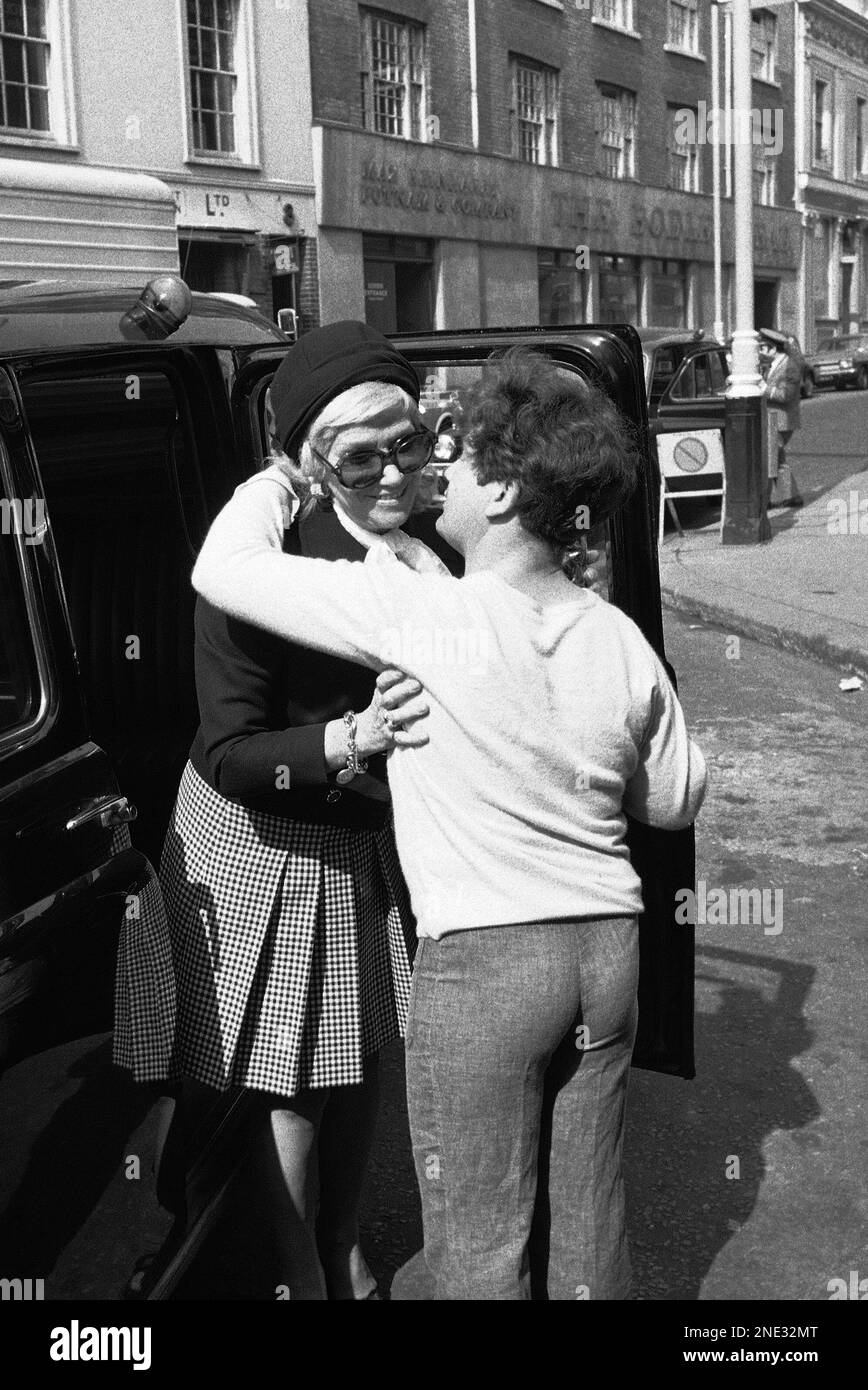 British singer Dorothy Squires gets a hug from Harry Crossan, a 38-year ...