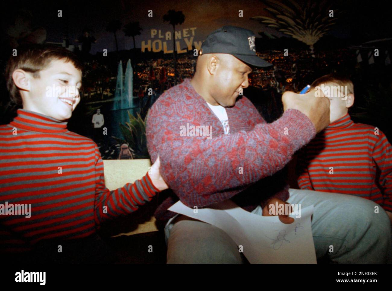 Eight-year-old Chad Choate from Dallas, Tex., puts the squeeze on ...