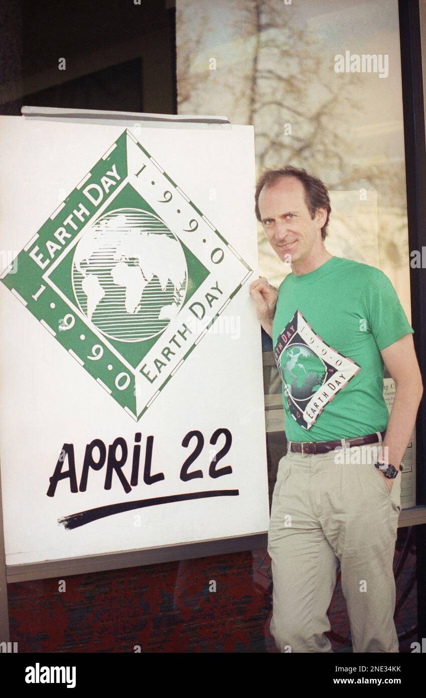 Earth Day founder Denis Hayes poses with an Earth Day sign outside ...