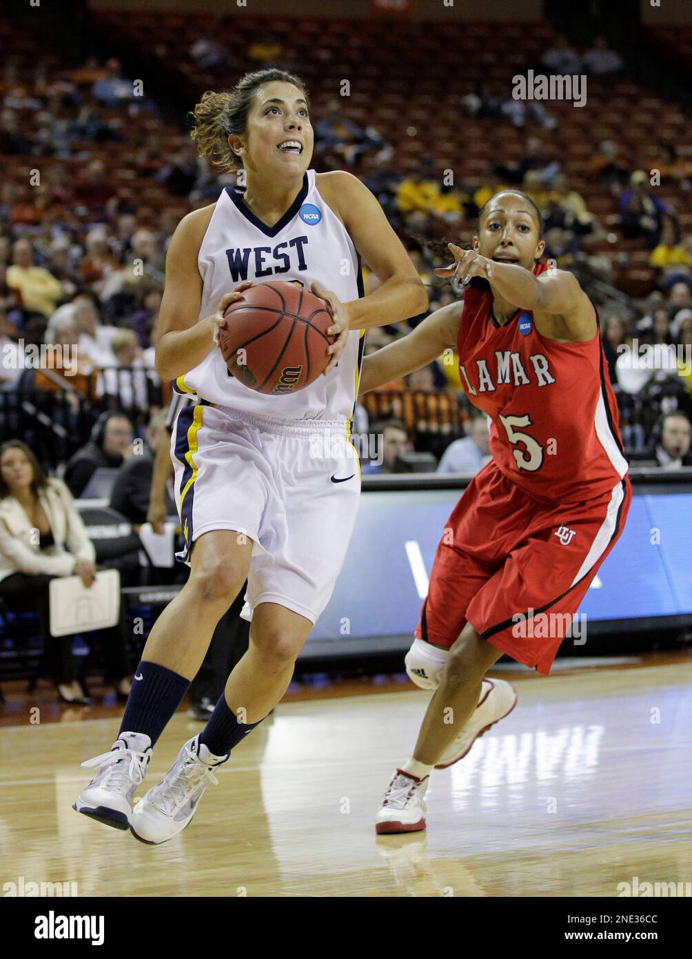 West Virginia's Liz Repella, left, is defended by Lamar's Kalis Loyd ...