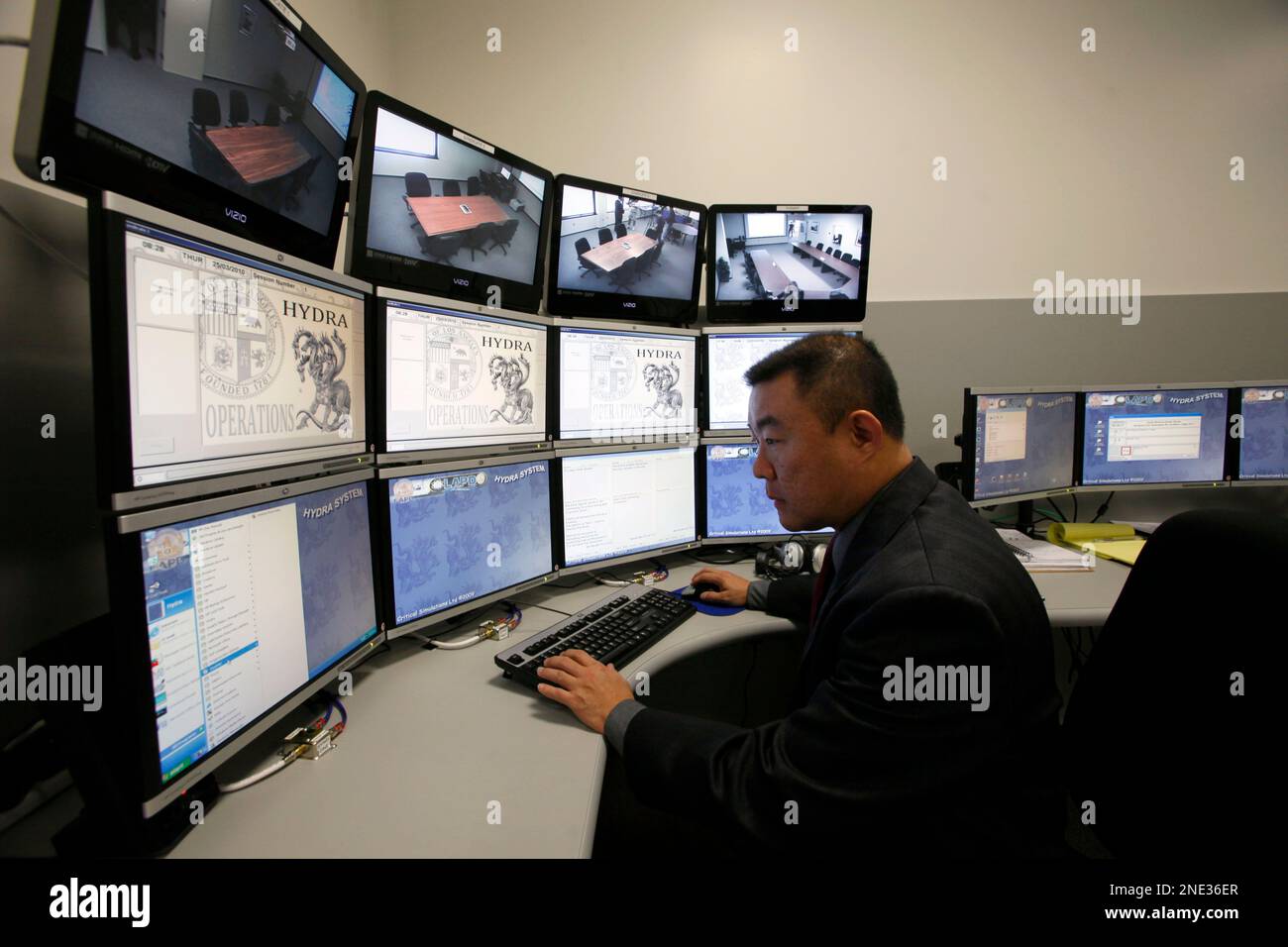 Los Angeles Police Officer John Lee looks over the first computerized ...
