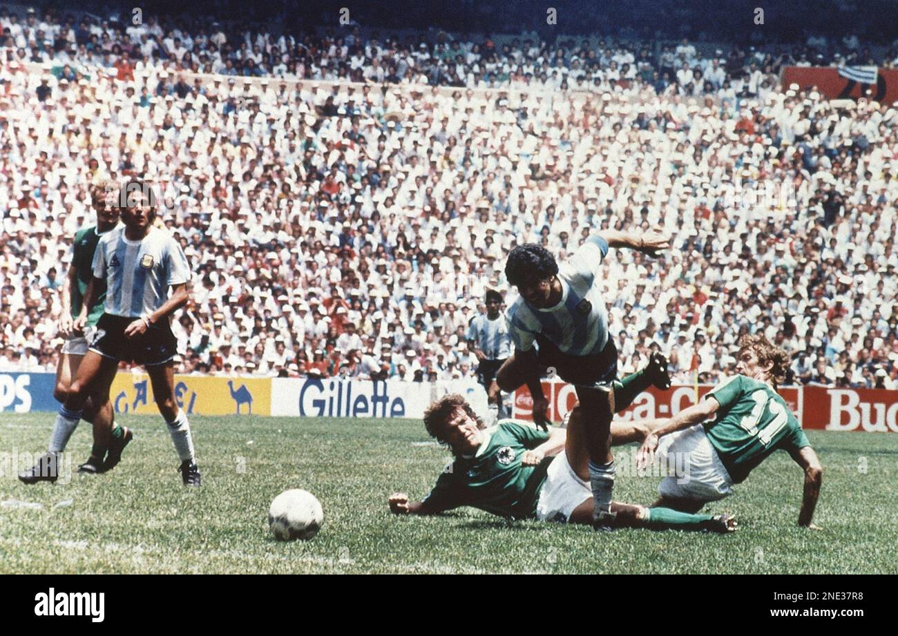 Argentina's Diego Maradona dribbles past West German players during the ...