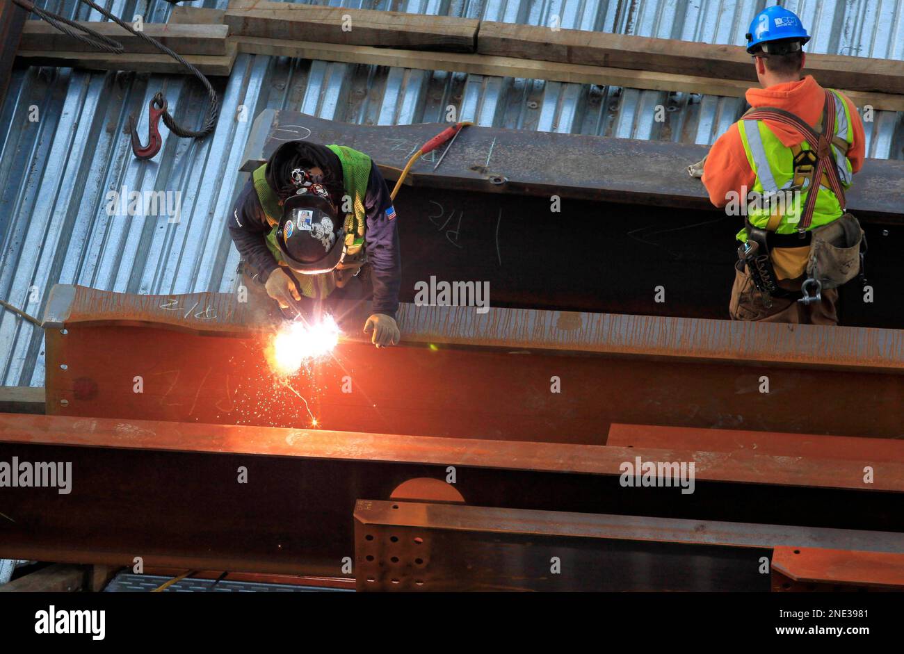 An ironworker welds a steel beam at One World Trade Center, Friday ...
