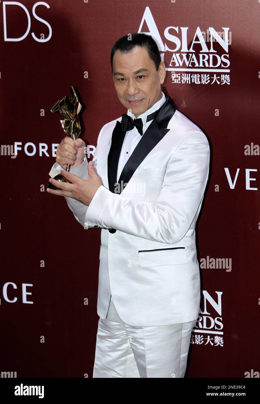 China's actor Wang Xueqi celebrates after winning the best actor of his ...