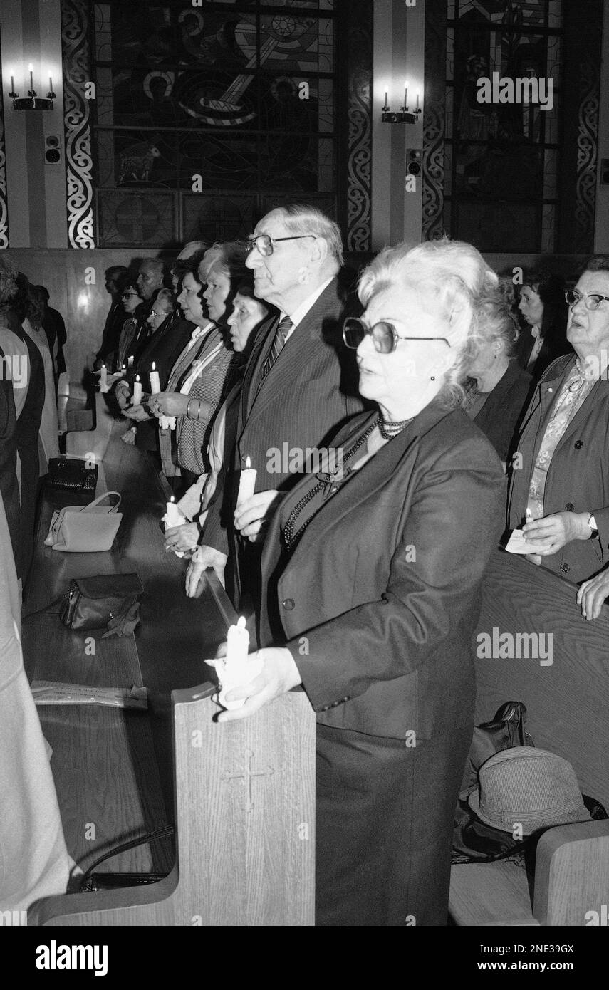 Ukrainian Americans hold a candlelight vigil for their relatives, possible victims of the ...