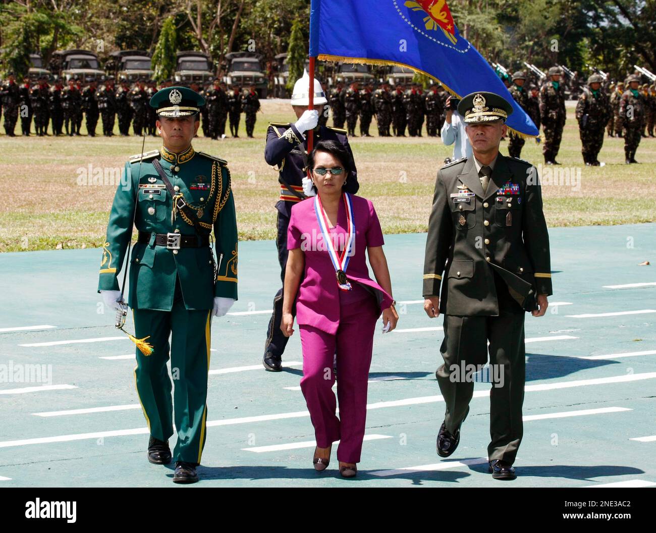 Philippine President Gloria Macapagal Arroyo, accompanied by Army Chief ...