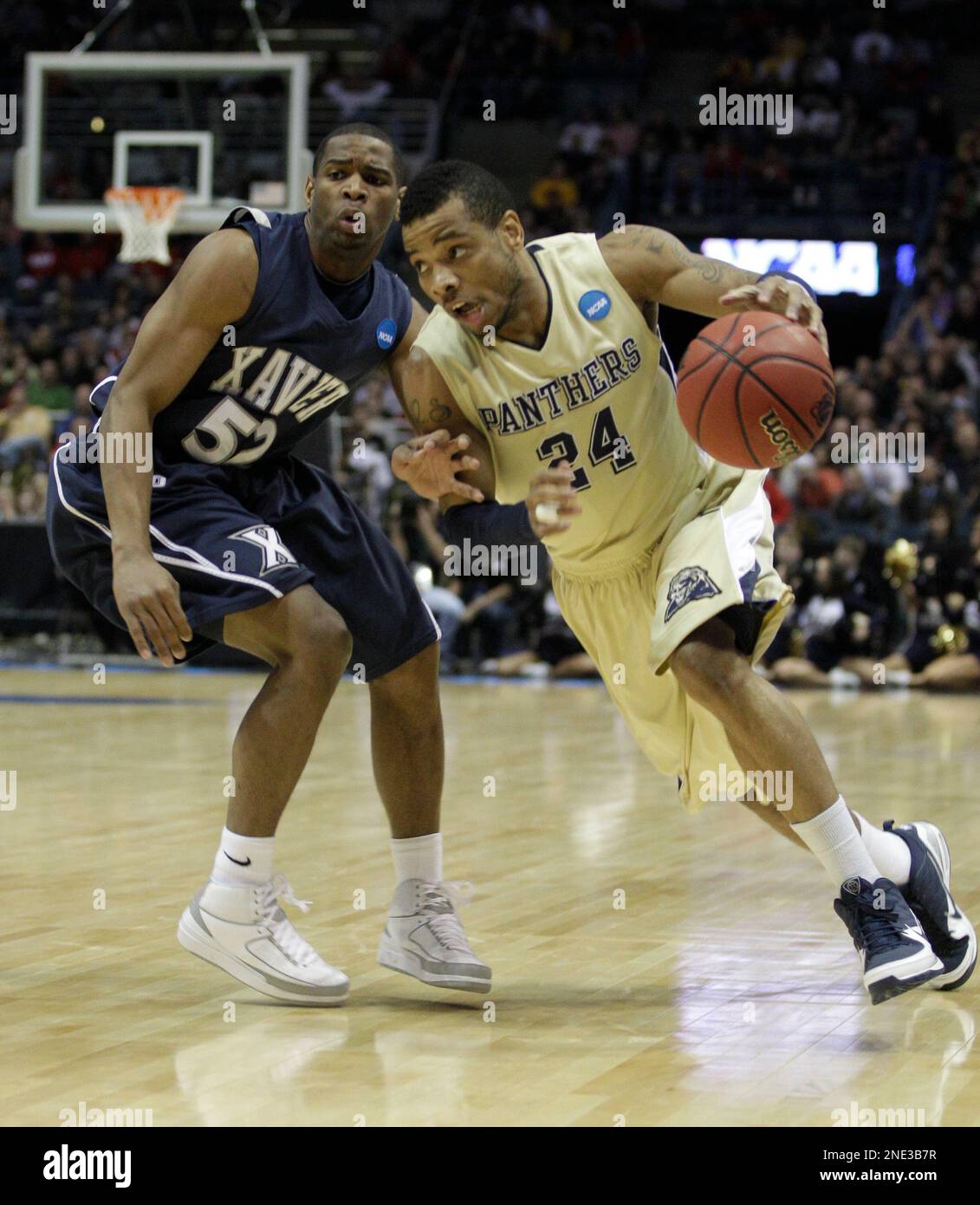 Pittsburgh's Jermaine Dixon drives past Xavier's Terrell Holloway in ...