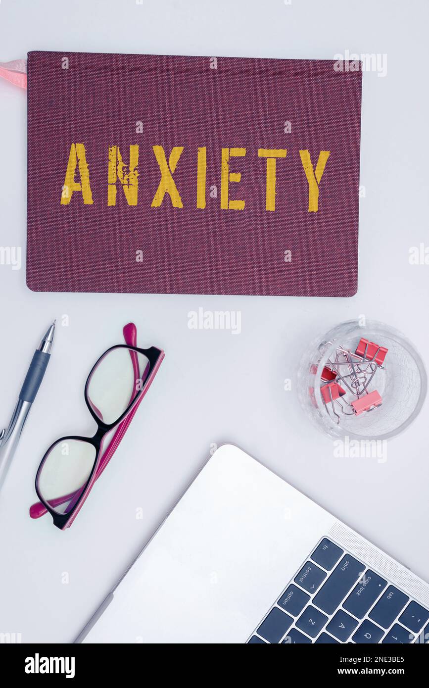 Hand writing sign Anxiety. Internet Concept Excessive uneasiness and ...