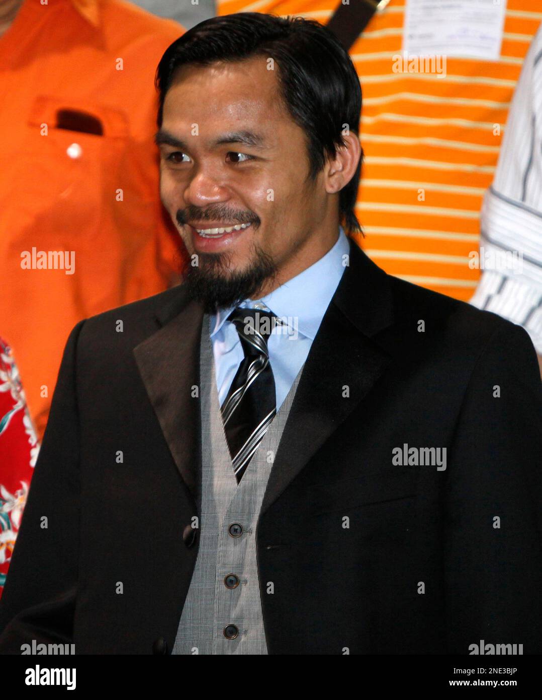 World boxing great Manny Pacquiao smiles as he arrives to another hero ...