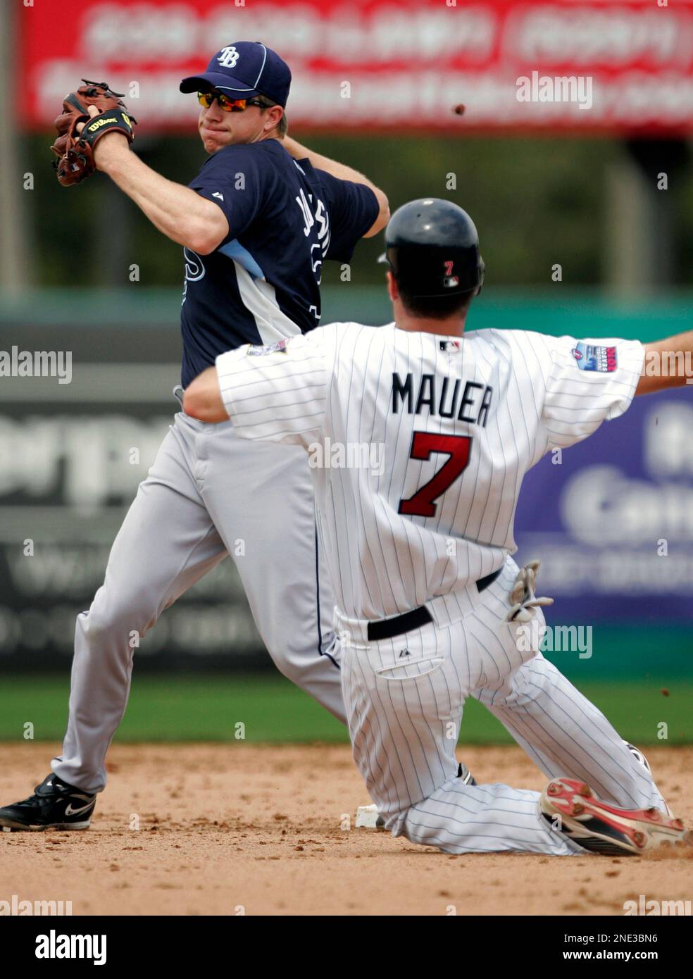 Minnesota Twins' Joe Mauer, right, is forced out at second on a single ...