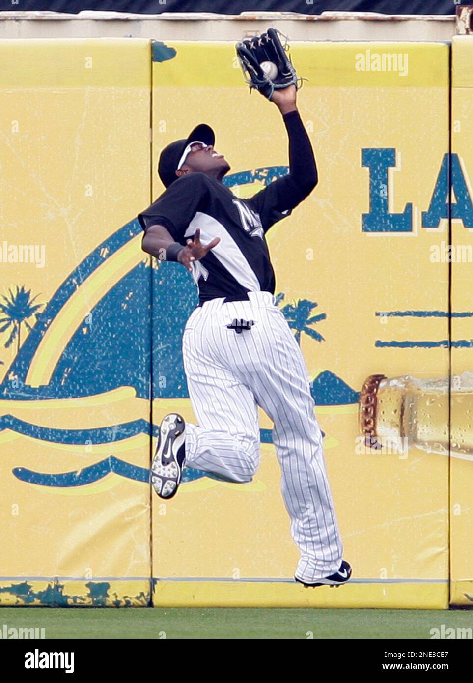 Florida Marlins center fielder Cameron Maybin snags a fly ball hit by ...