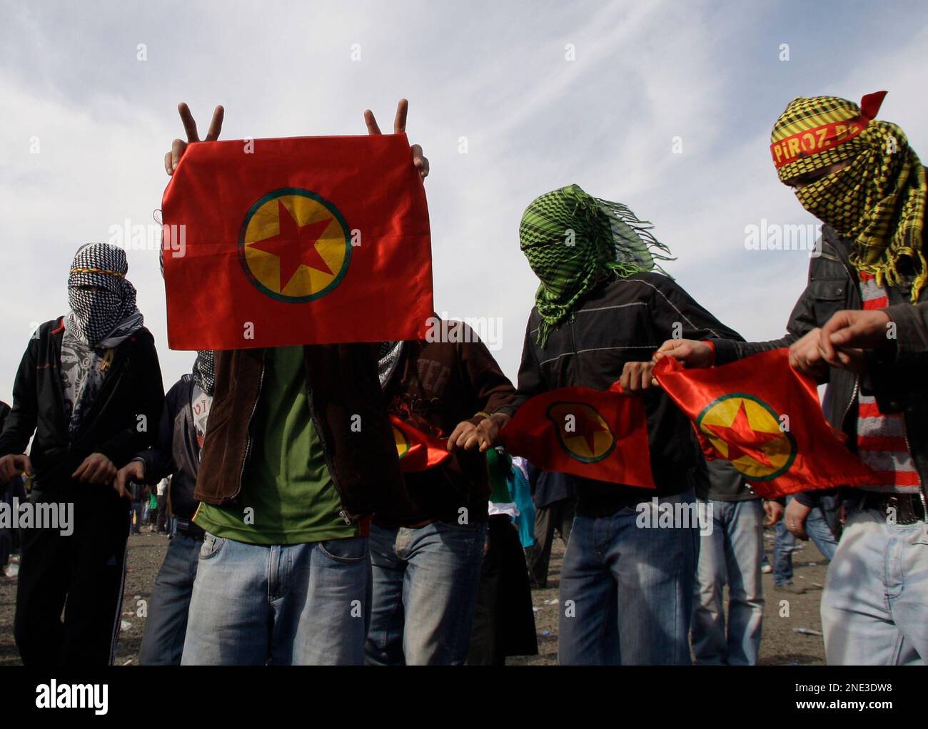 Masked men display flags of outlawed rebel group of the PKK, as Turkish ...