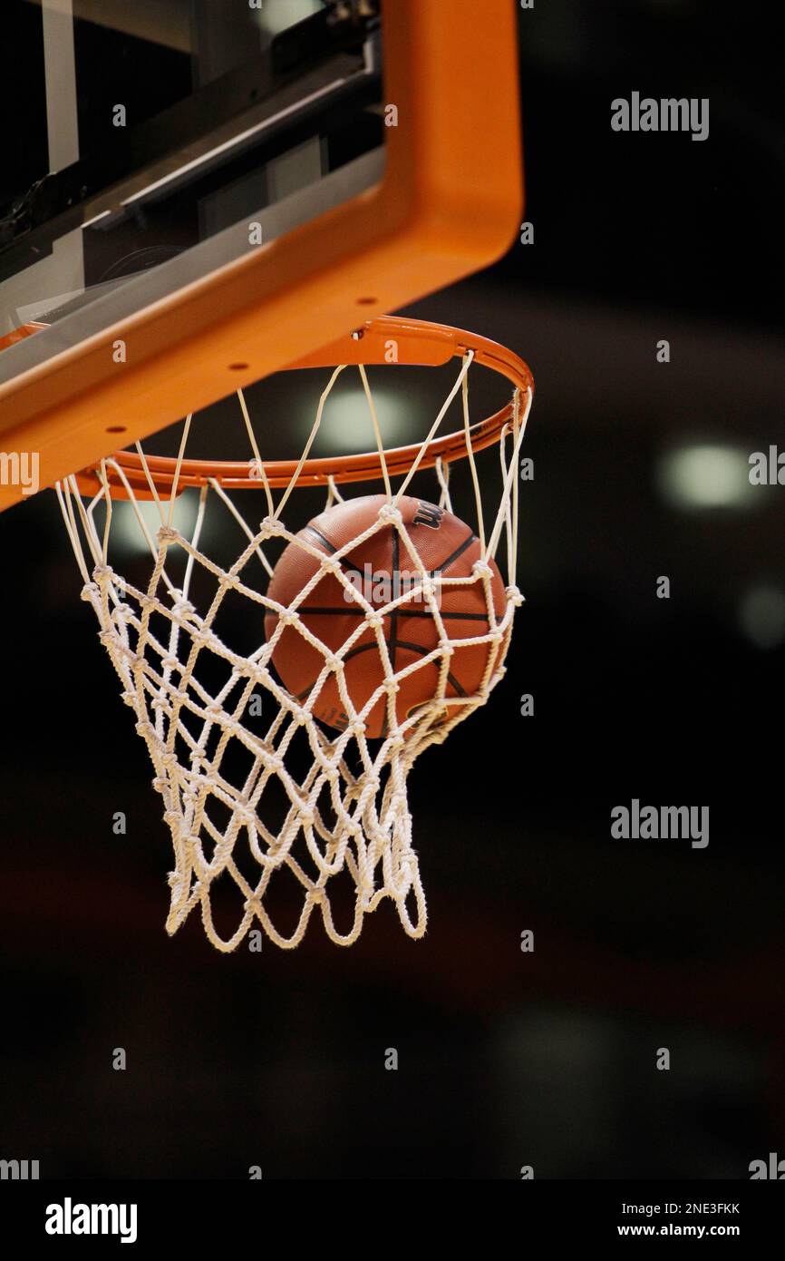 A ball falls through the net in the first half of an NCAA first-round ...