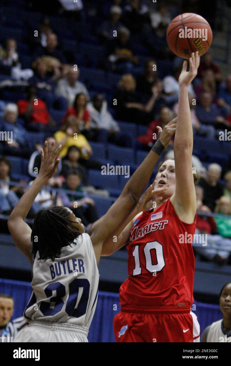Marist's Kate Oliver, right, shoots over Georgetown's Jaleesa Butler ...