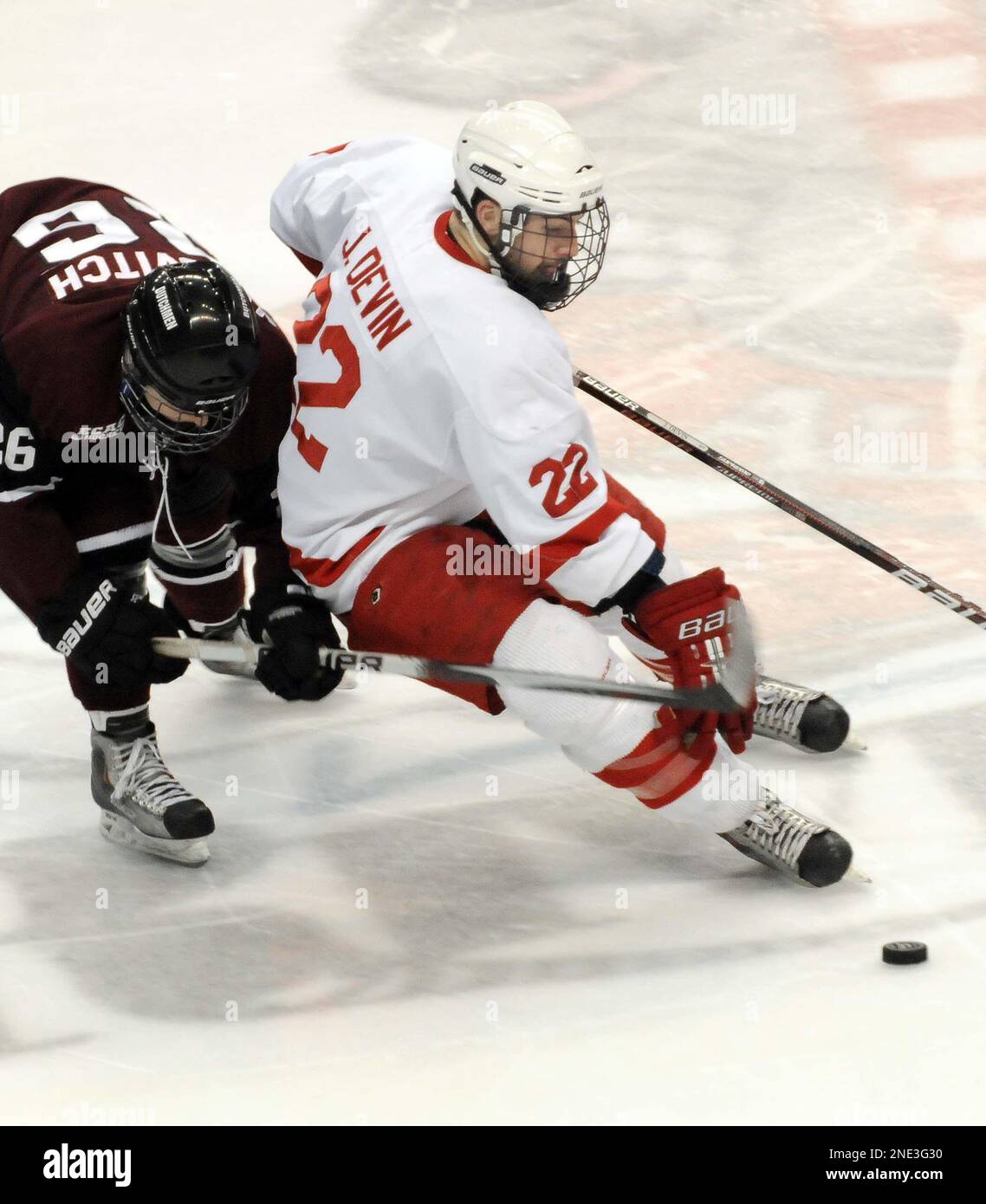 Cornell player Joe Devin (22) right, and Union player Brian Yanoviych ...