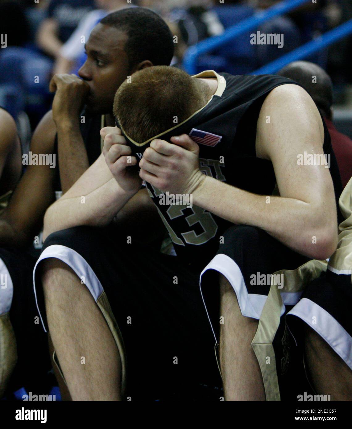 Wake Forest center Chas McFarland (13) sits on the bench during the ...