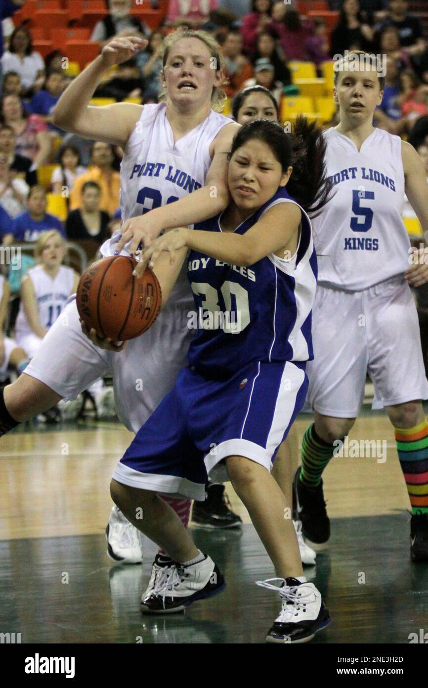 Fort Yukon's Micala Peter (30) battles with Port Lions center Sariah ...