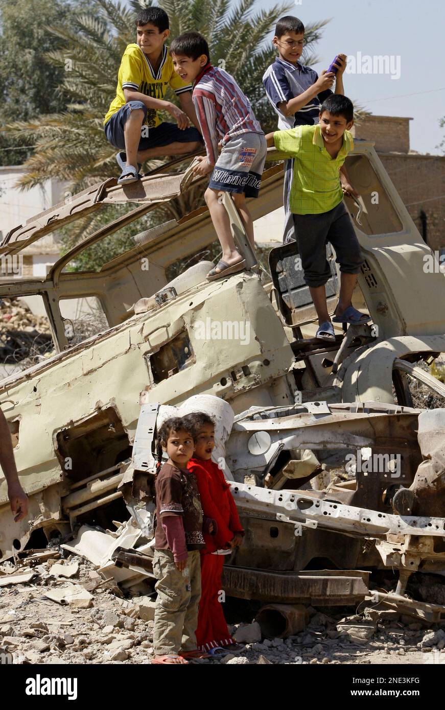 Young Iraqi children play at a military base belonging to the former ...