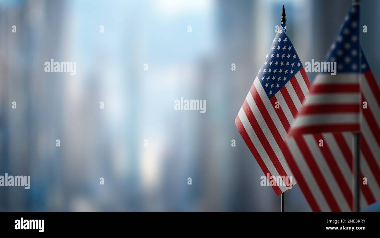 Small flags of the USA on an abstract blurry background Stock Photo - Alamy