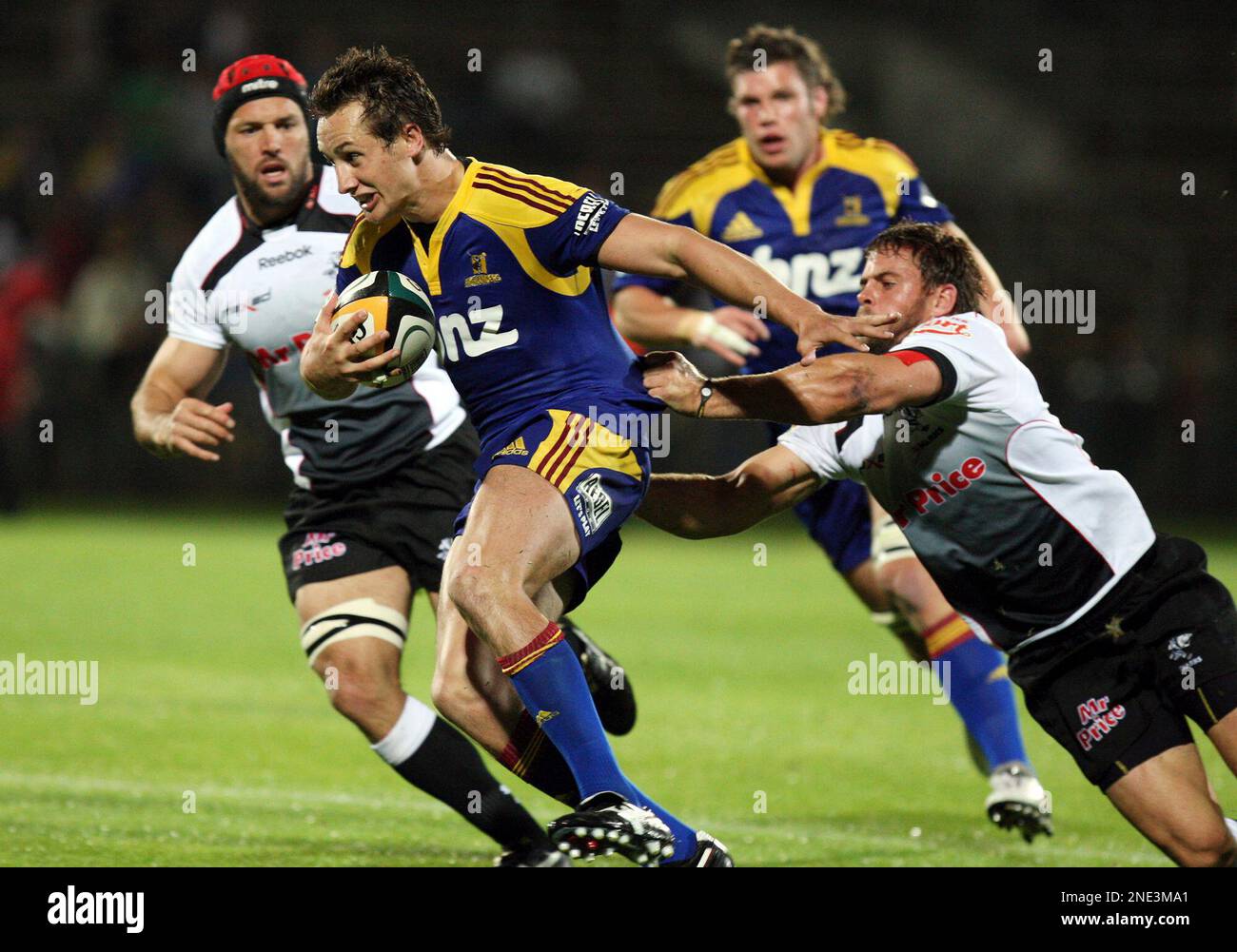 Highlander's Michael Hobbs, second from left, tries to break through a ...