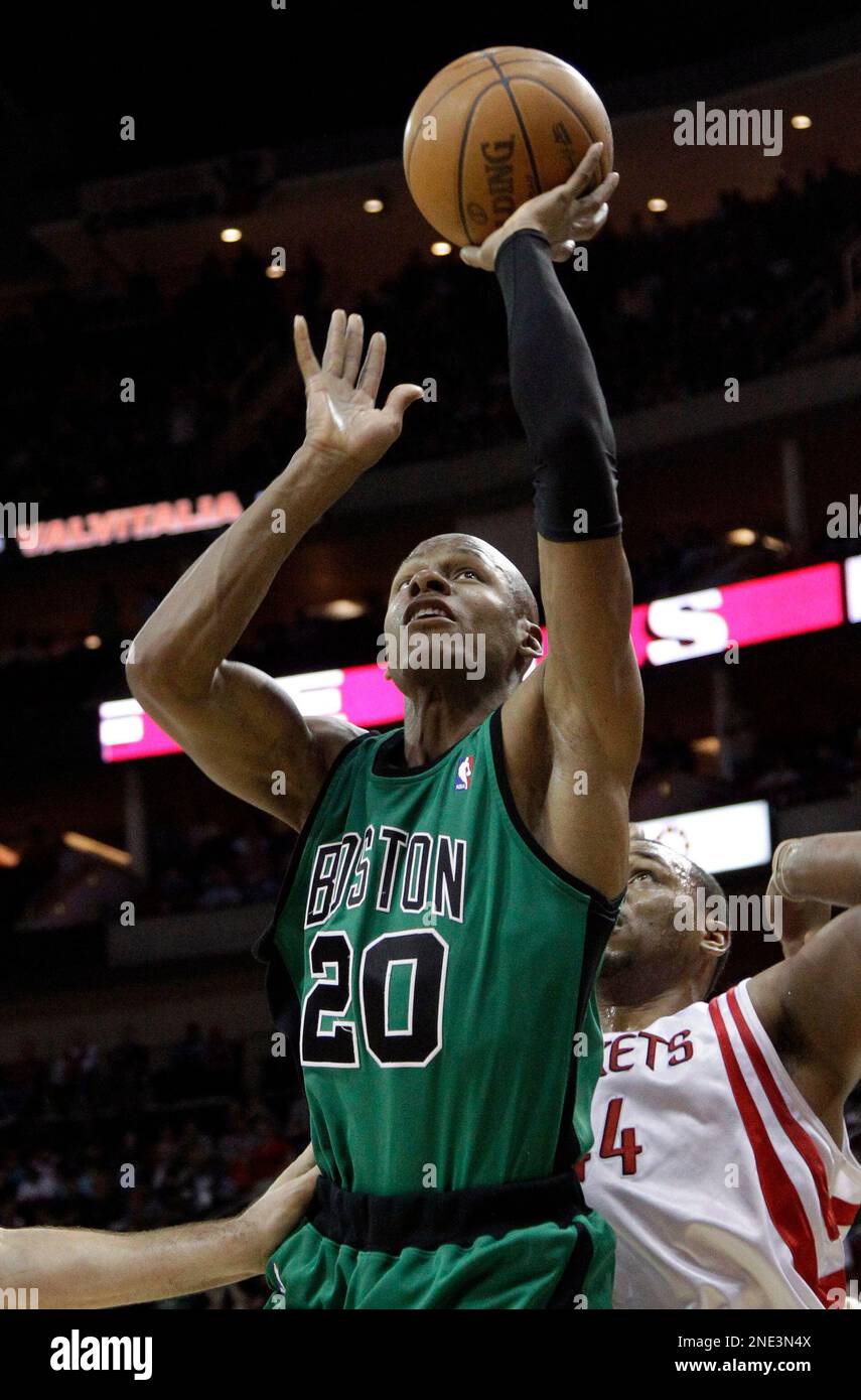 Boston Celtics' Ray Allen (20) shoots as Houston Rockets' Chuck Hayes ...
