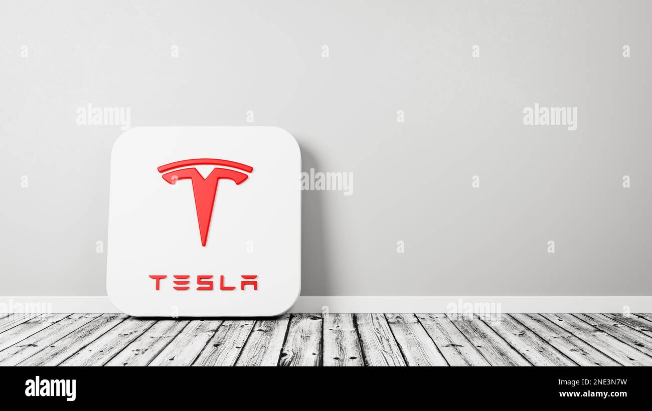Tesla App Icon on Wooden Floor Against Wall Stock Photo - Alamy