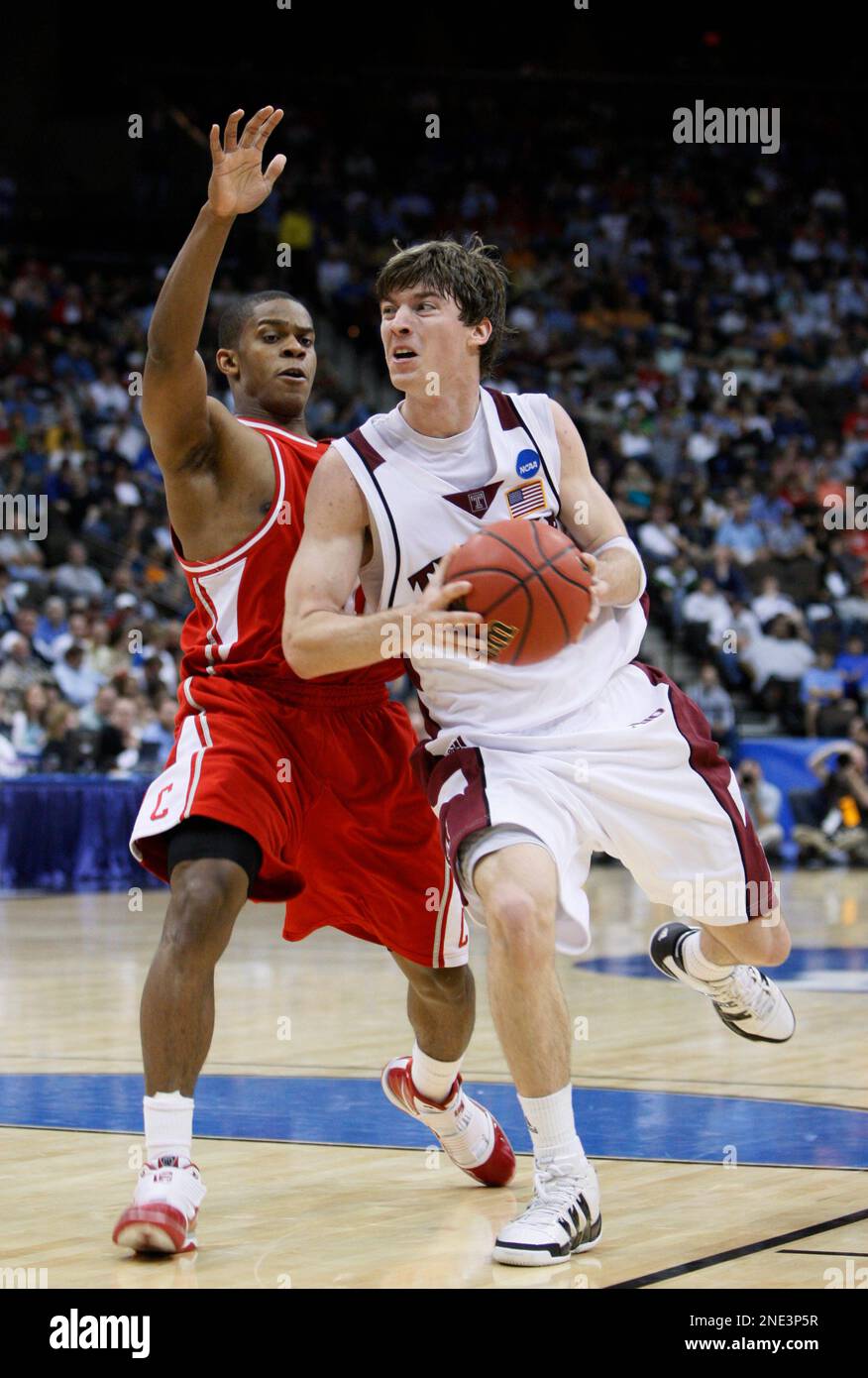 Temple's Juan Fernandez drives to the basket as Cornell's Louis Dale ...